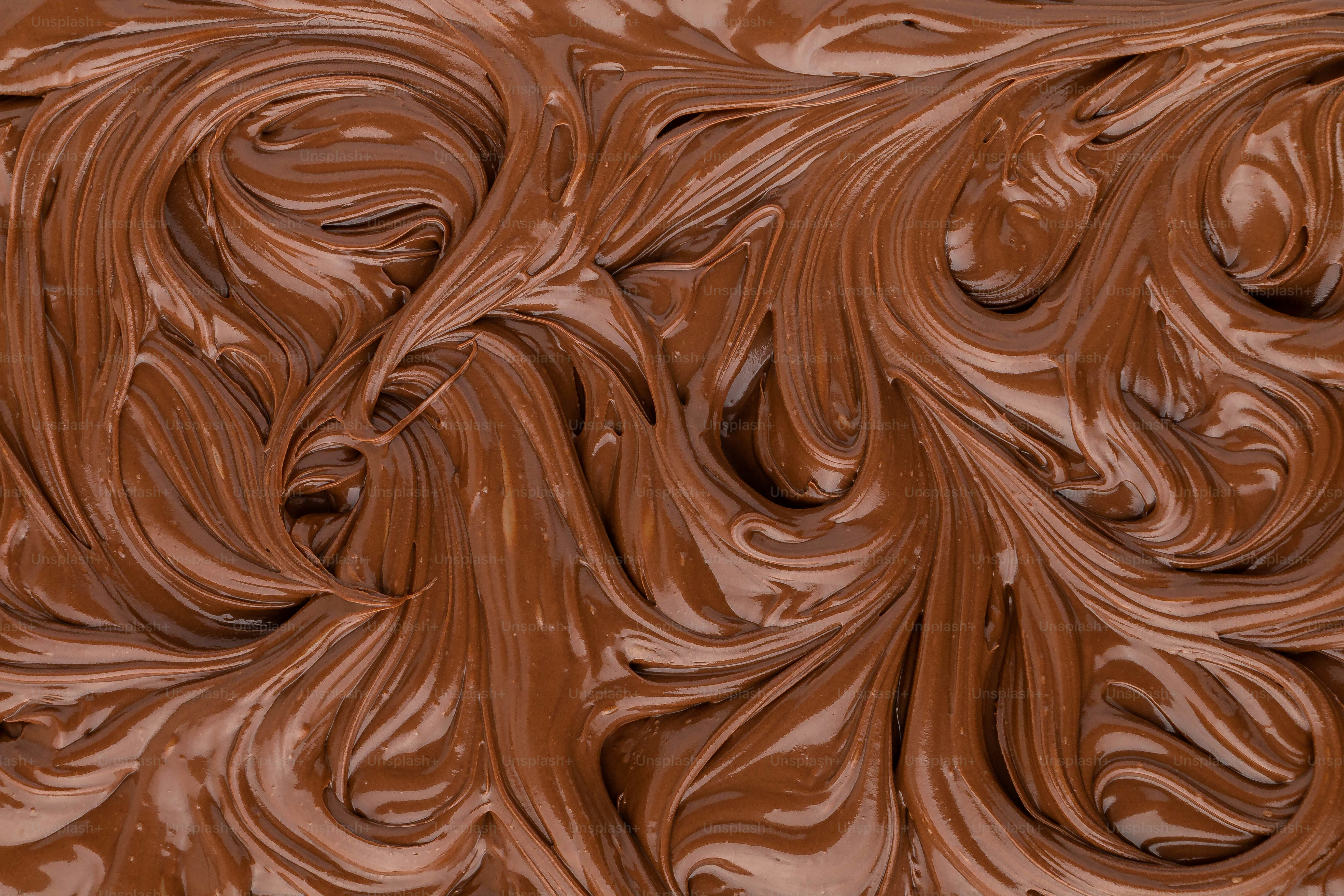 A close up of a chocolate swirl pattern photo – Chocolates Image on ...
