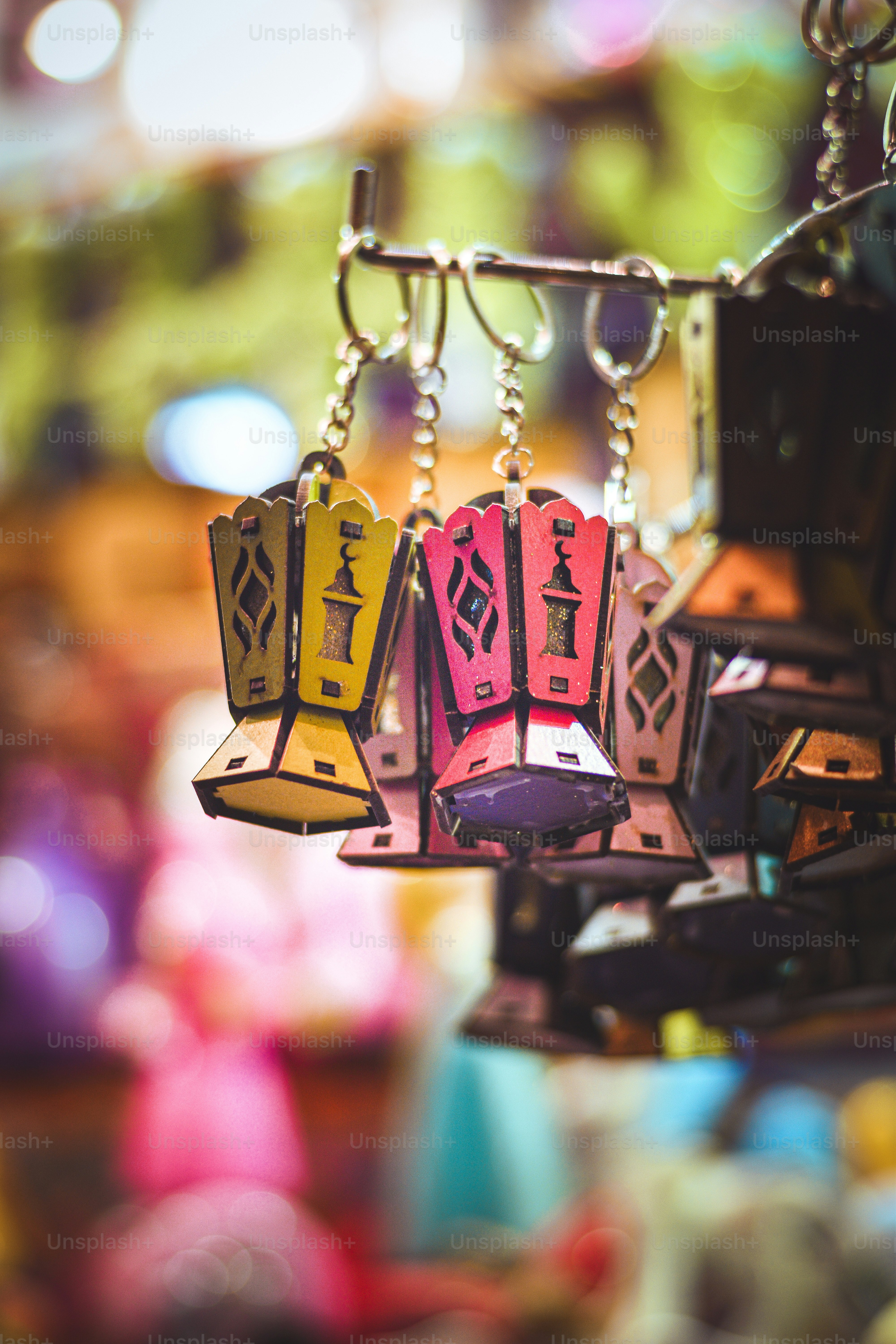 A bunch of colorful lights hanging from a ceiling photo – Islamic Image ...