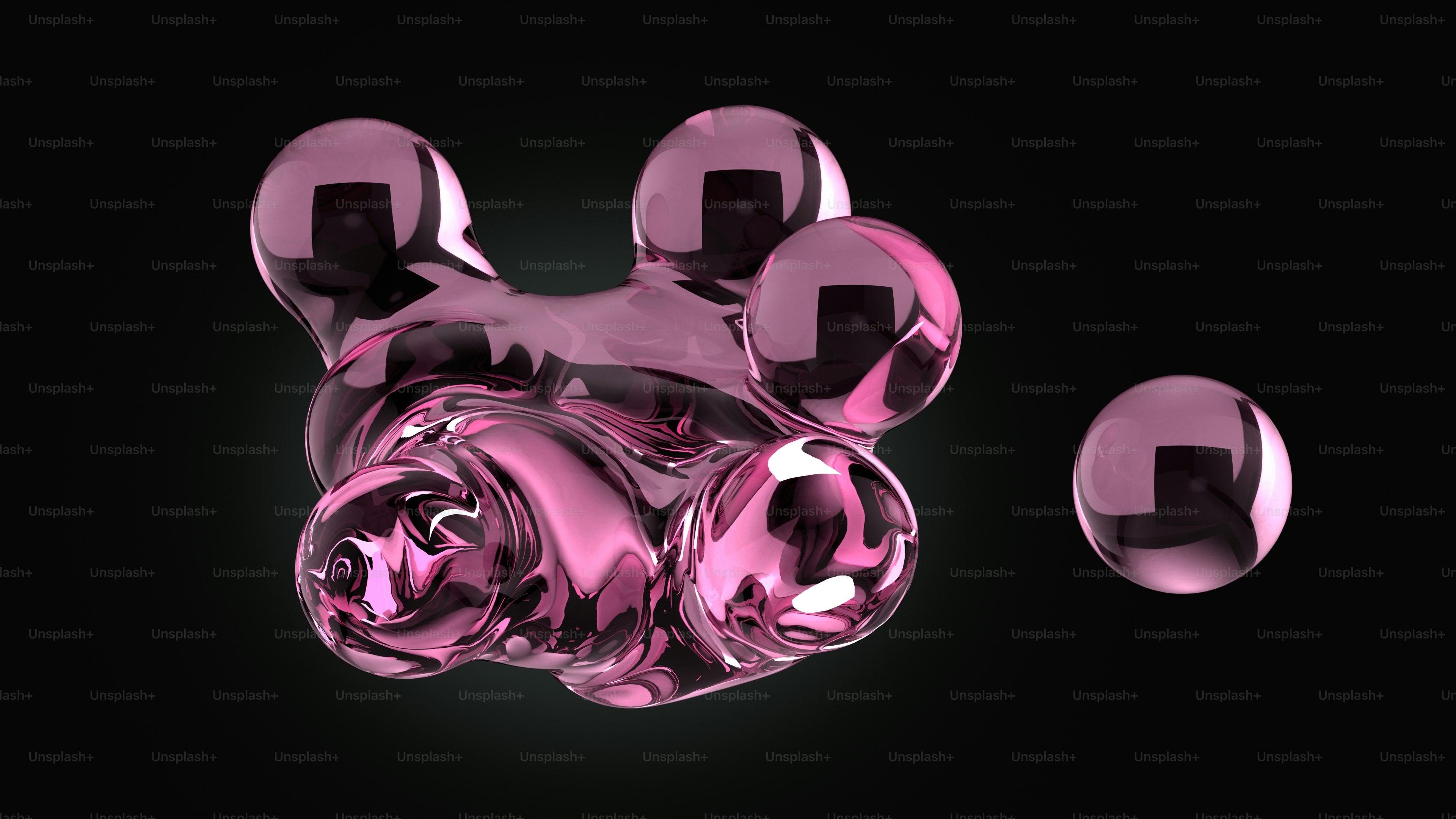 A pink mickey mouse glass sculpture on a black background photo ...
