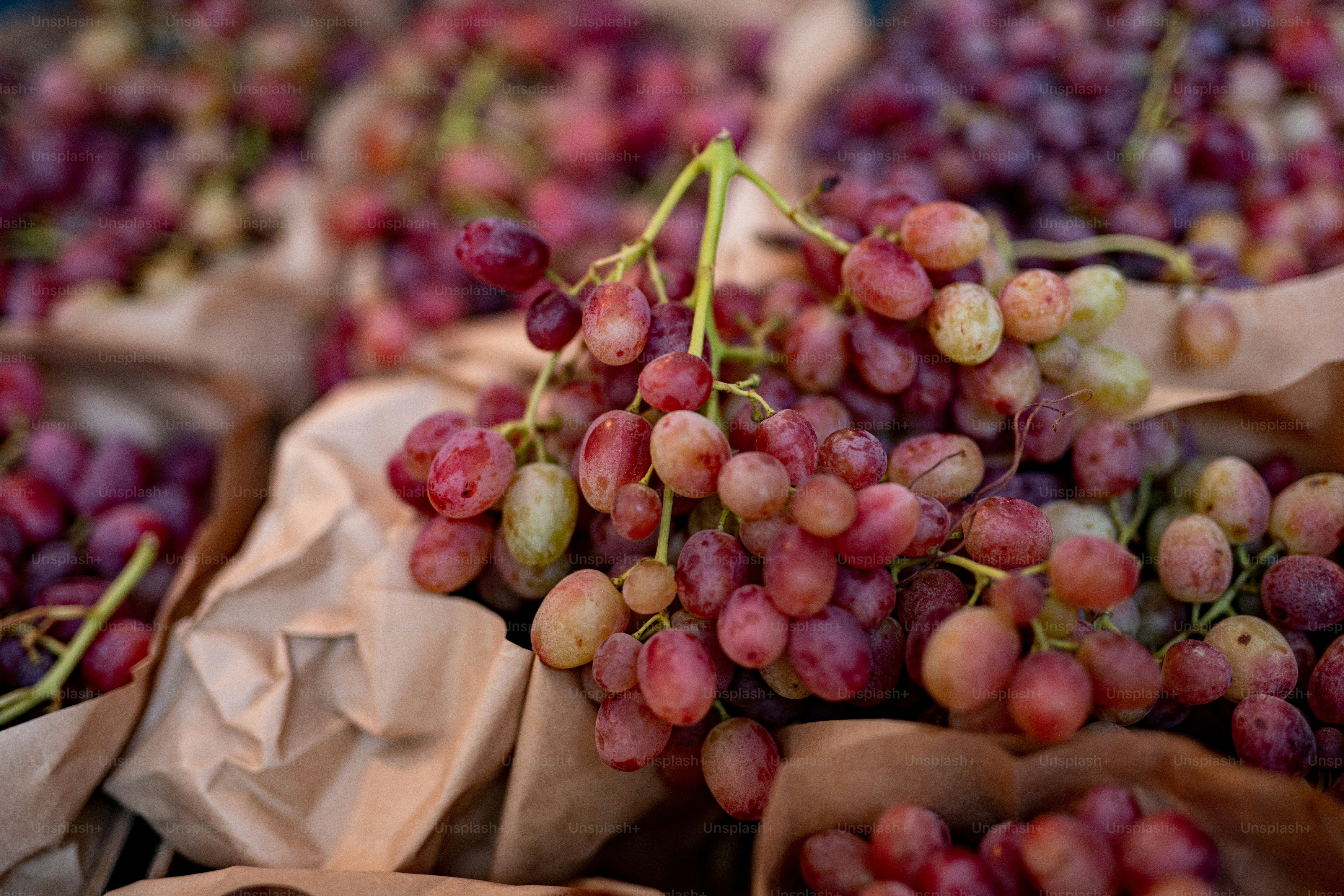 A bunch of grapes that are on a table photo – Grapes Image on Unsplash