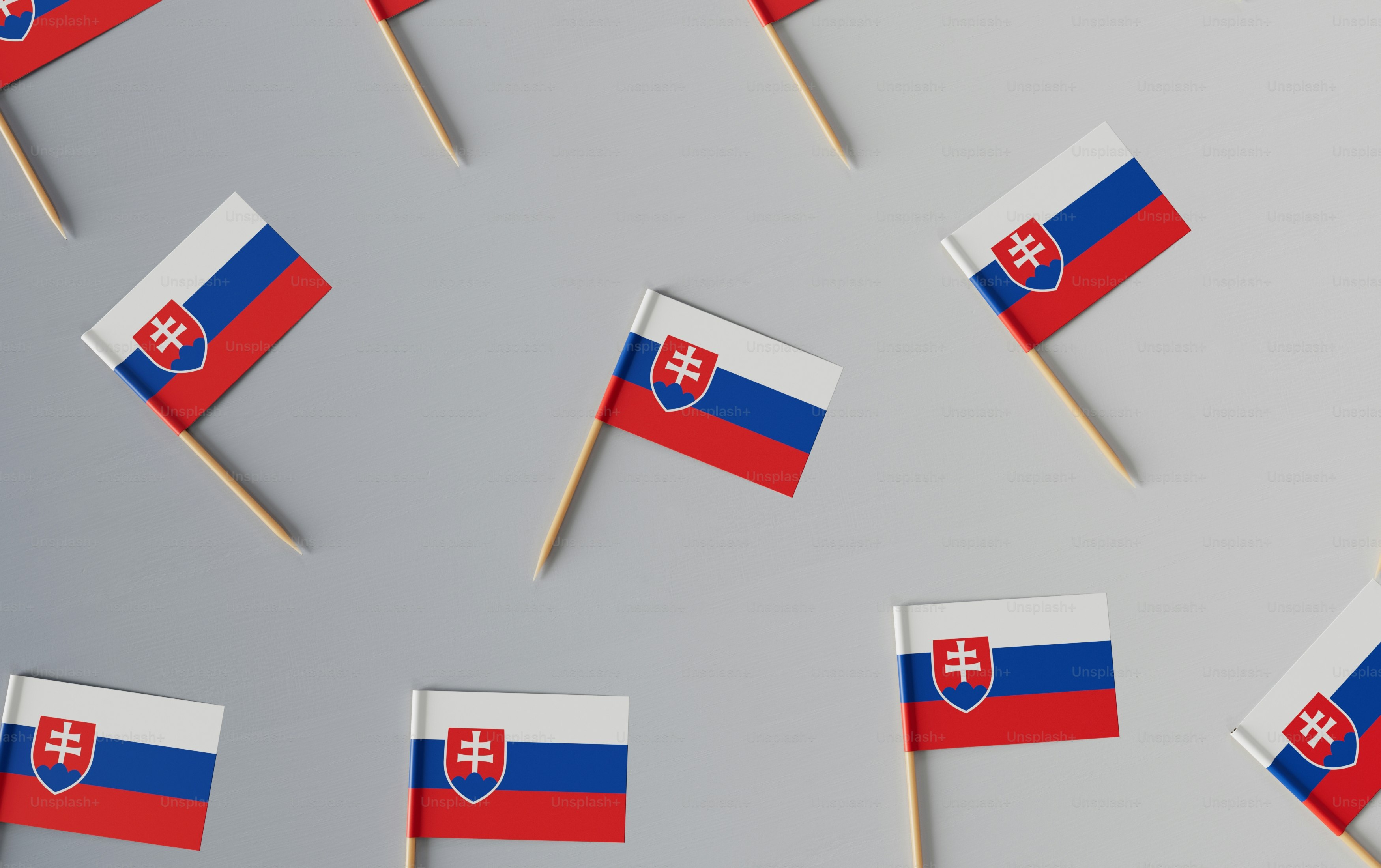 A group of small red flags with gold stars on them photo – Wallpaper ...