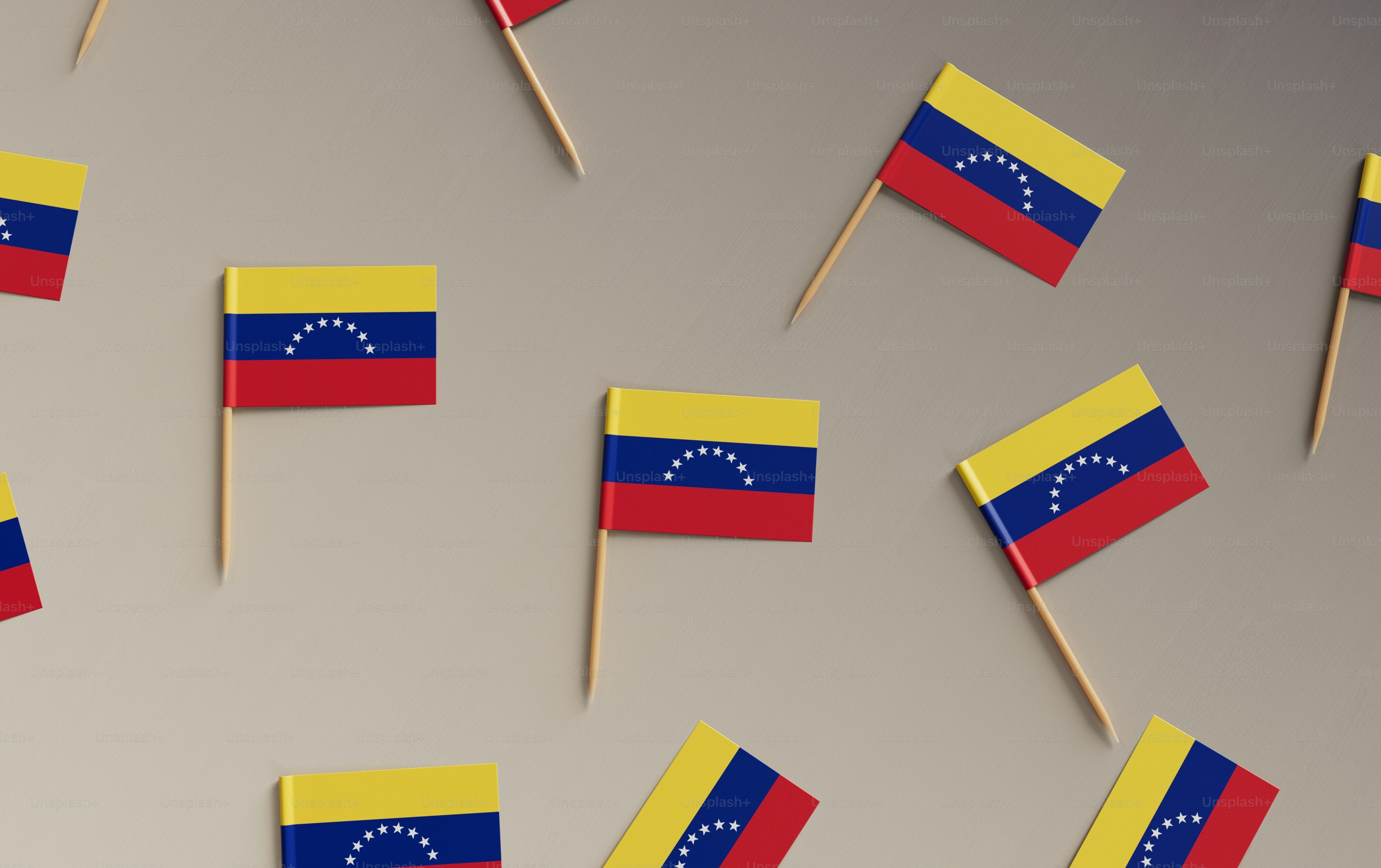 A bunch of flags that are on a table photo – Russian flag Image on Unsplash