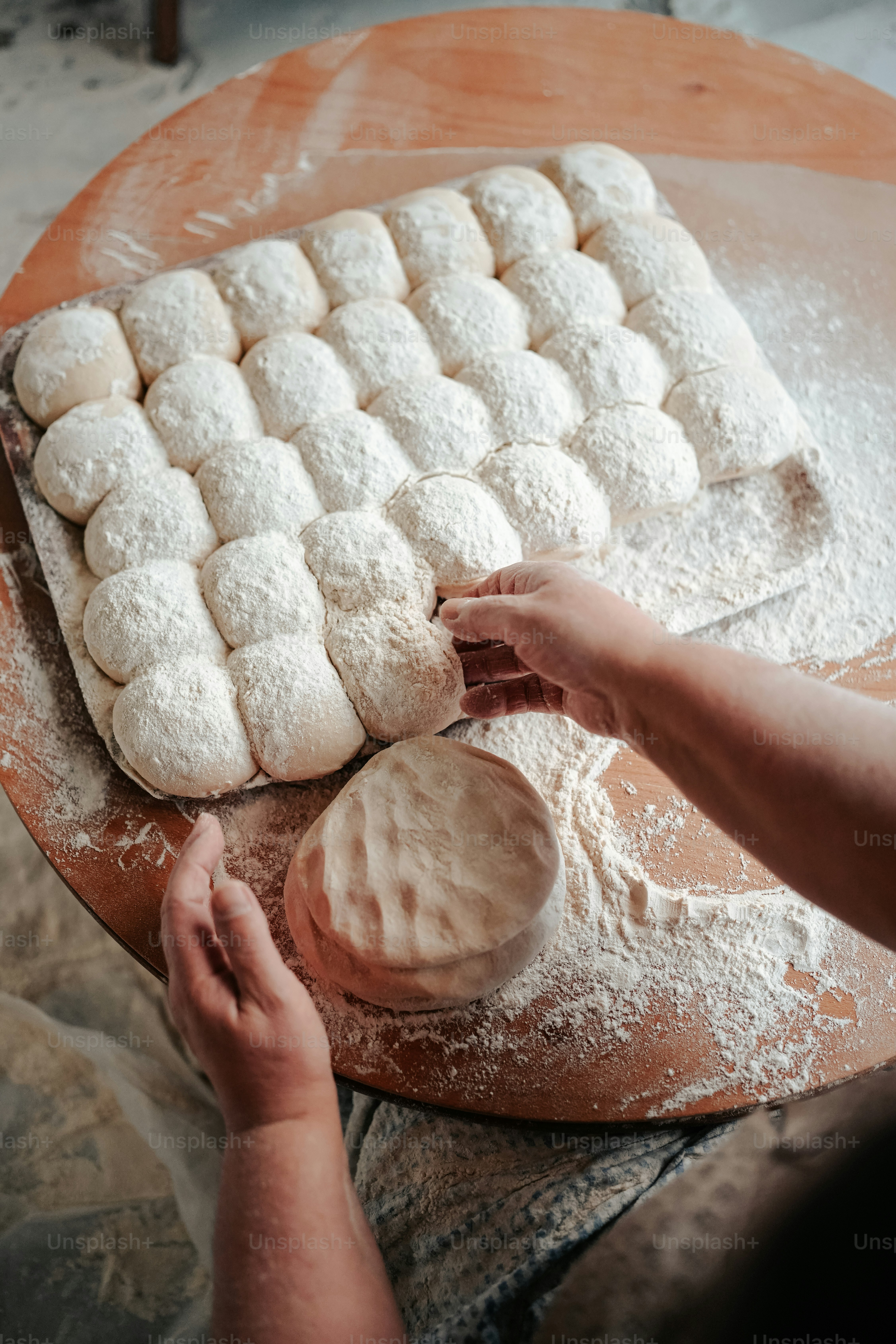 A person that is making some food on a table photo – Woman Image on ...