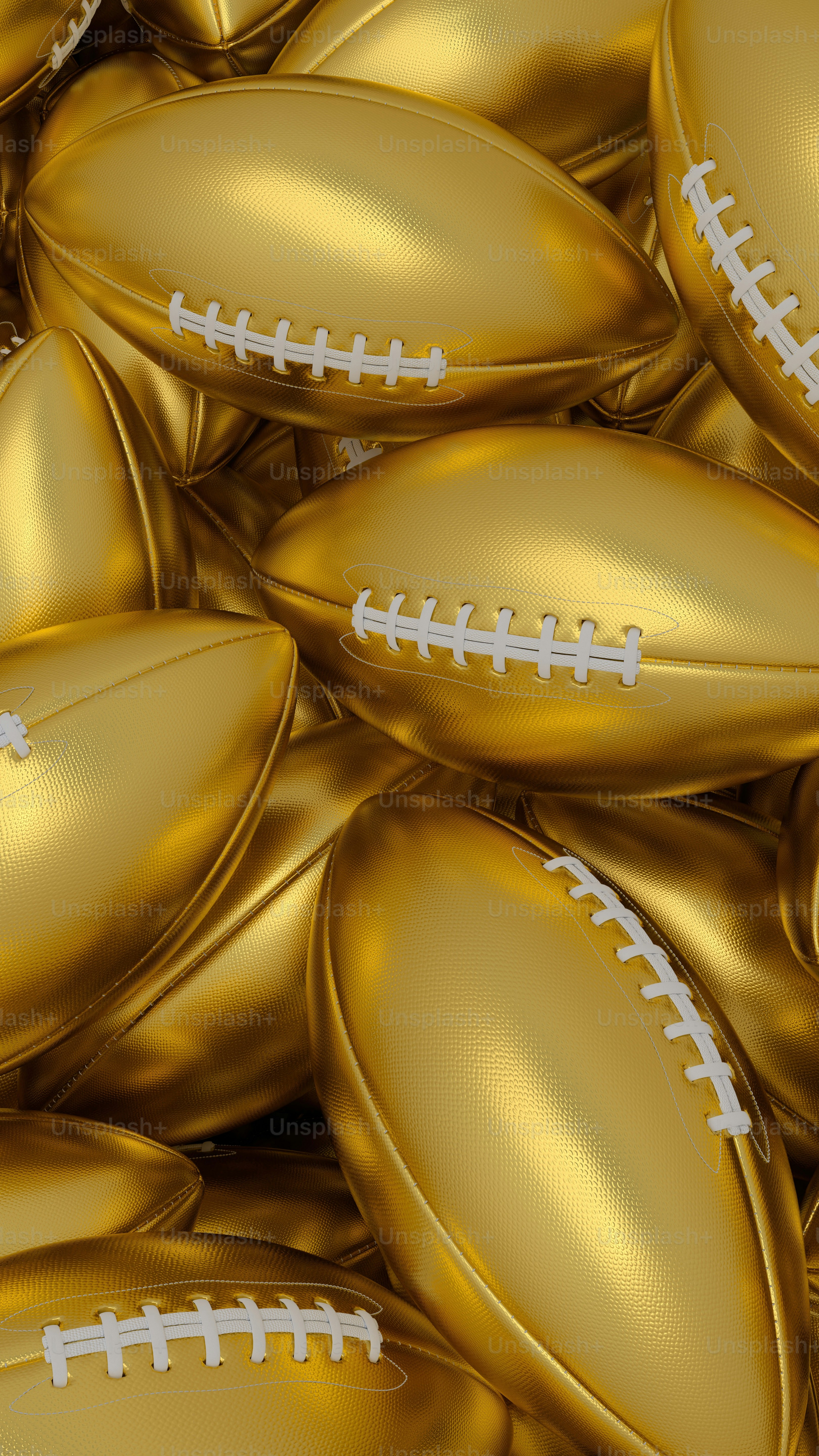 A pile of gold footballs with white stitching photo – Sport Image on ...