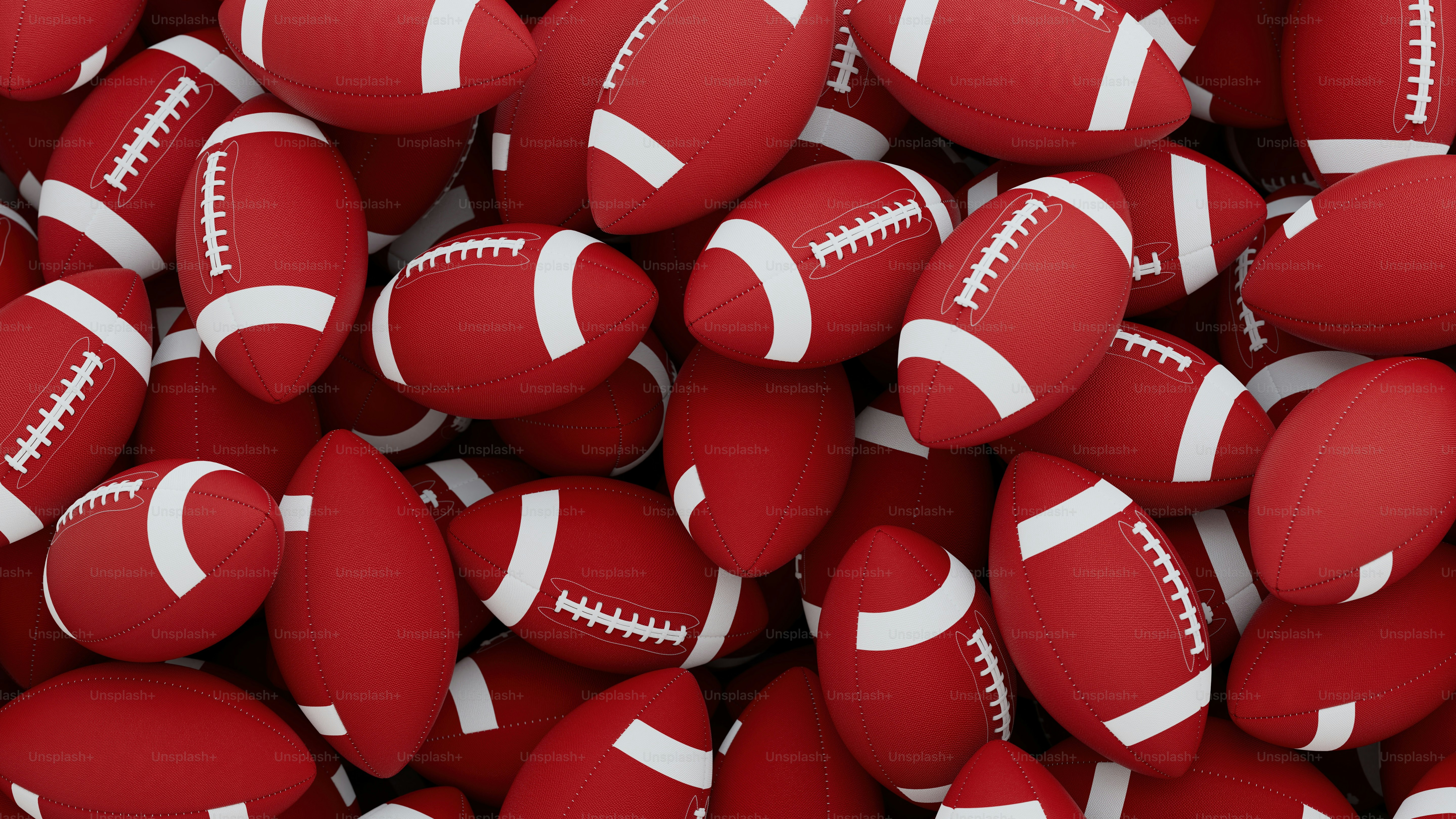 A large pile of red and white footballs photo – American Image on Unsplash