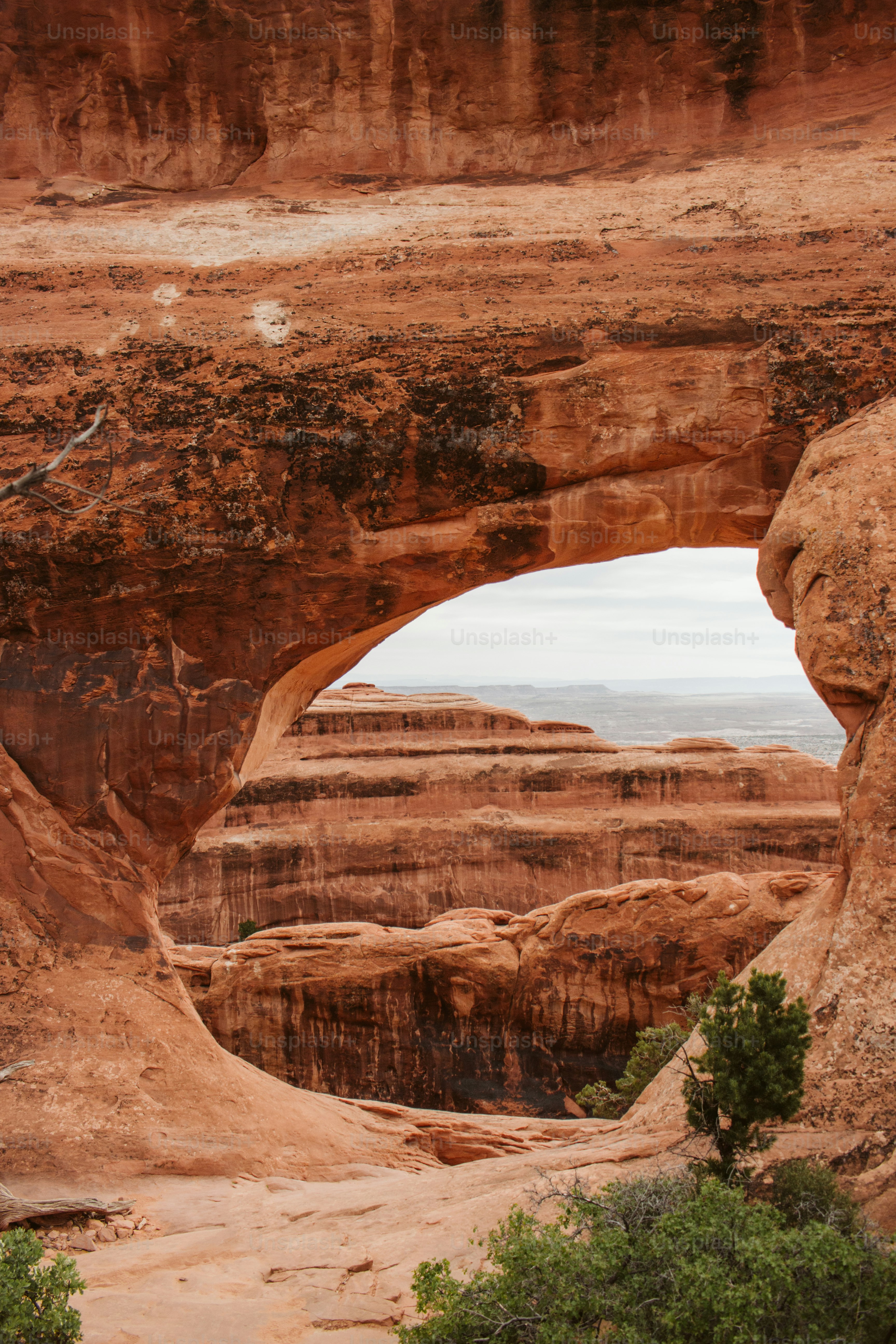 A large rock formation with a hole in the middle photo – National park ...