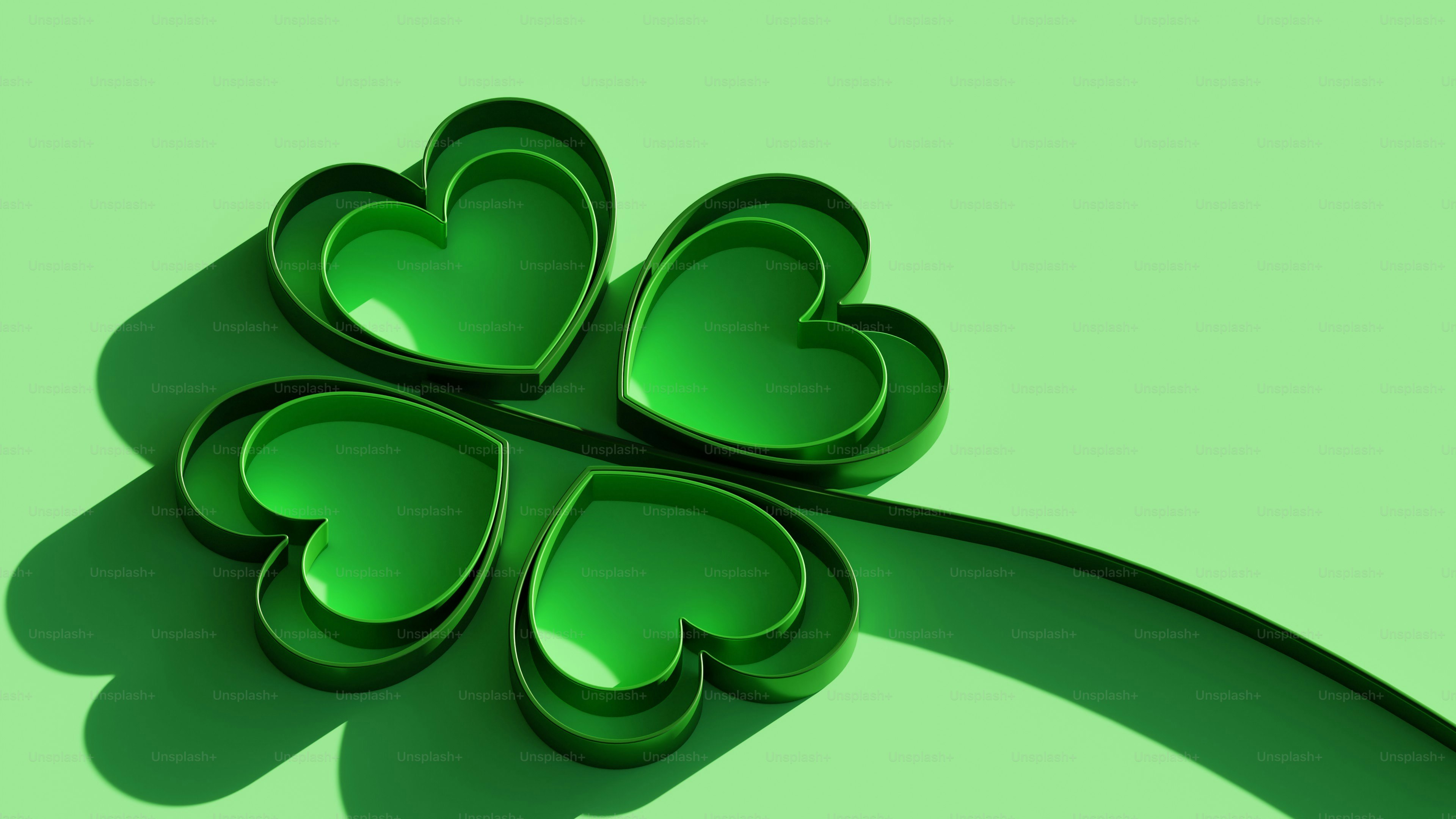A four leaf clover shaped object on a green background photo – Green ...