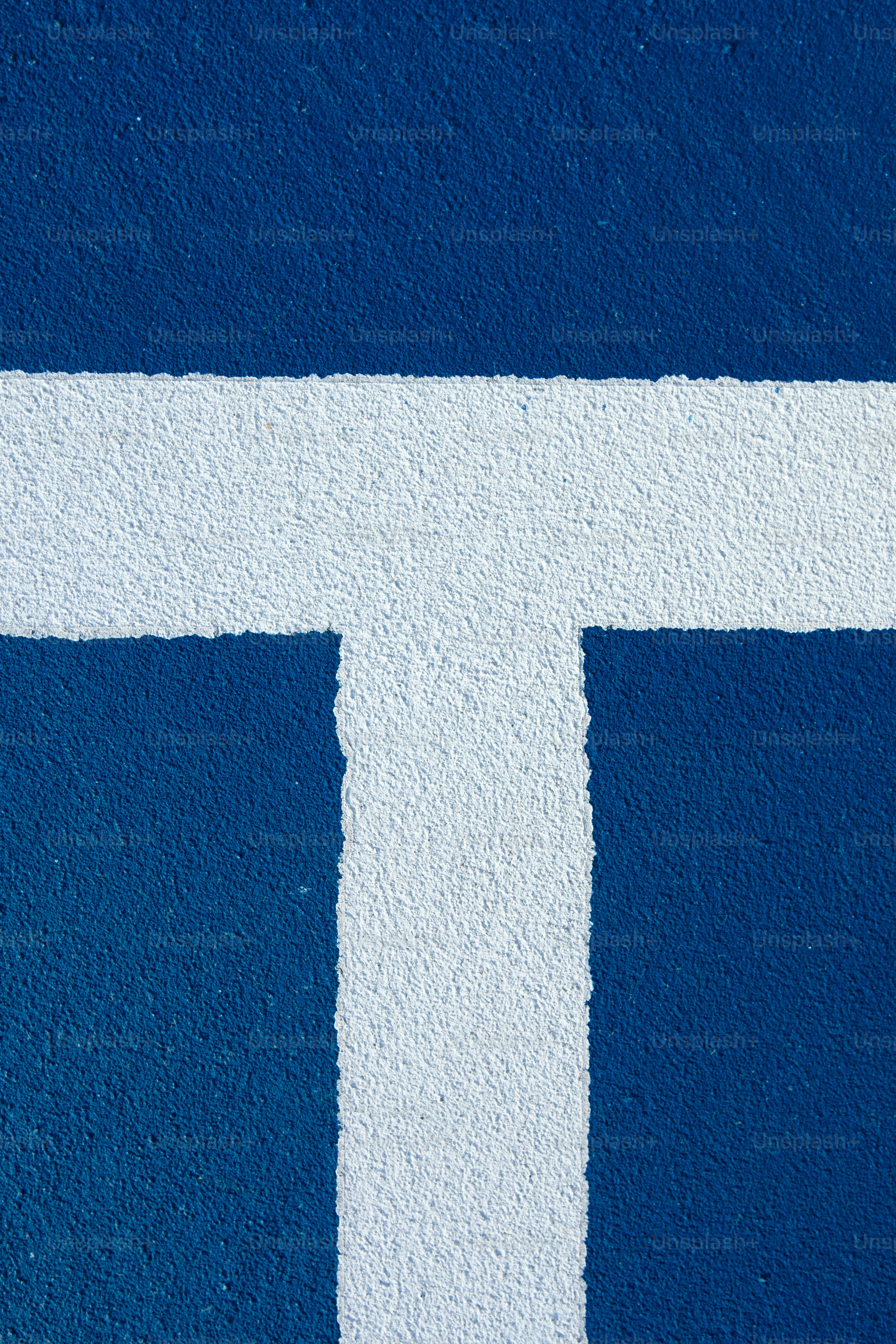A white cross painted on a blue wall photo – Texture Image on Unsplash
