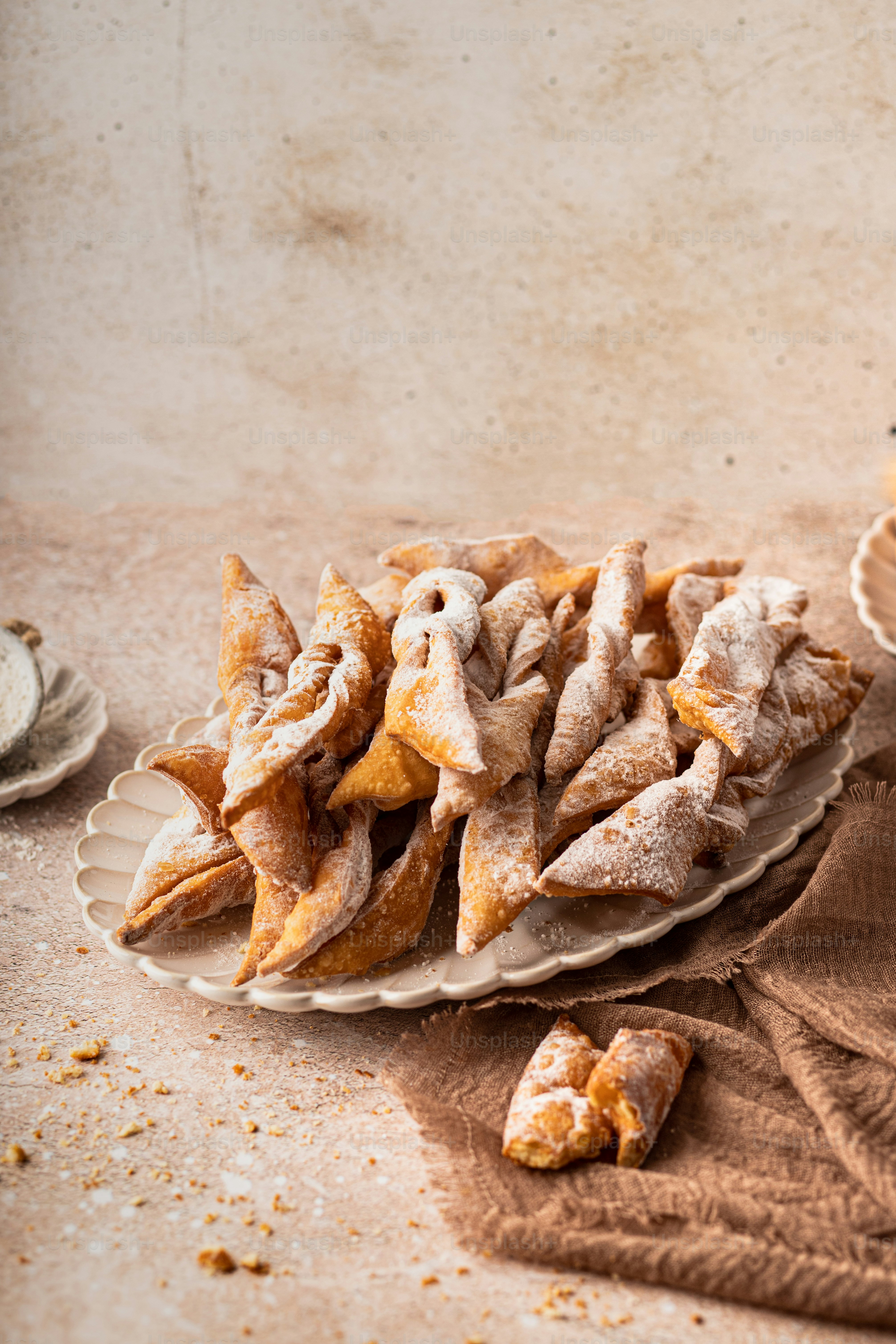 A pile of pastries sitting on top of a white plate photo – Pastry Image ...