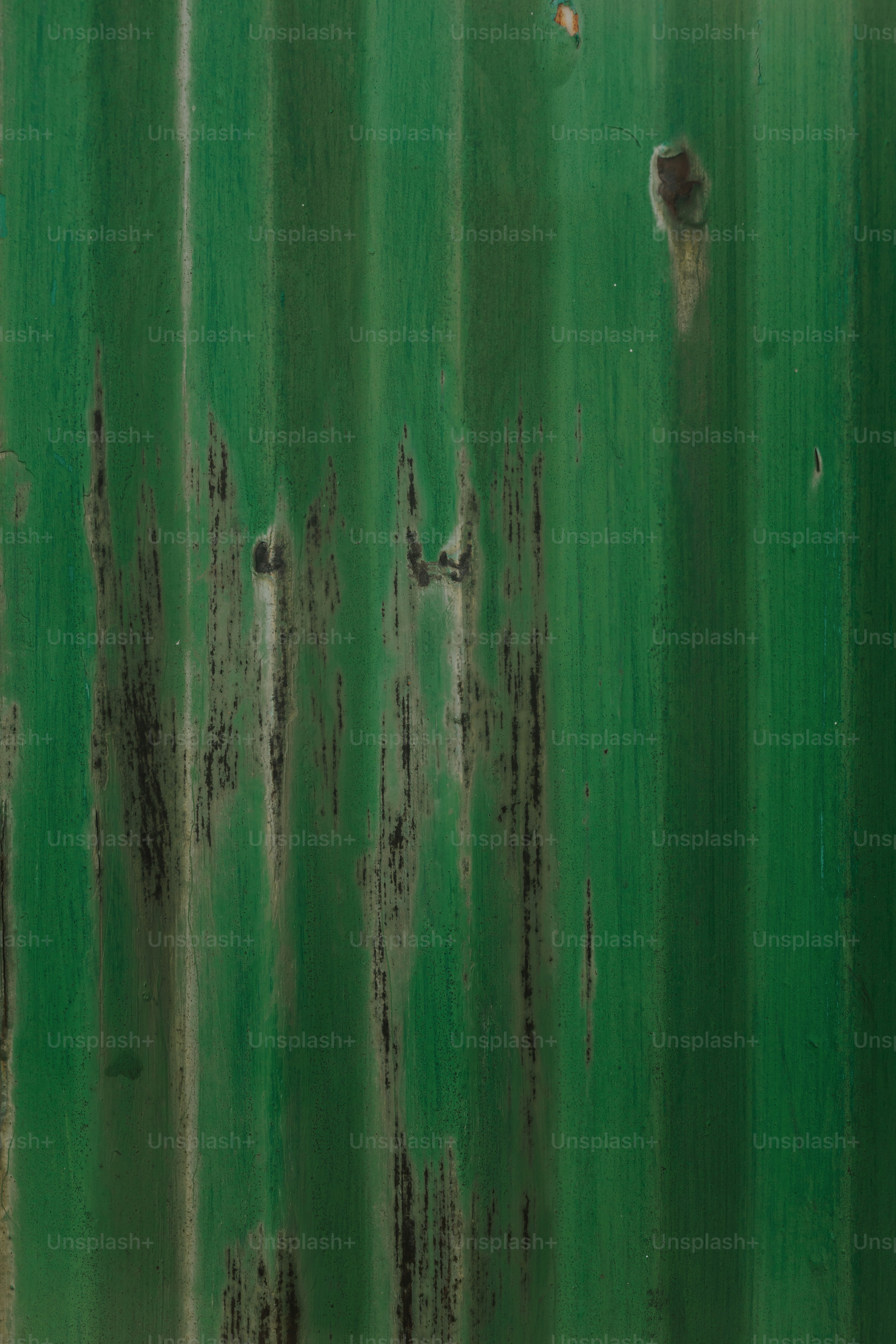A rusted metal surface with green paint photo – Green background Image ...