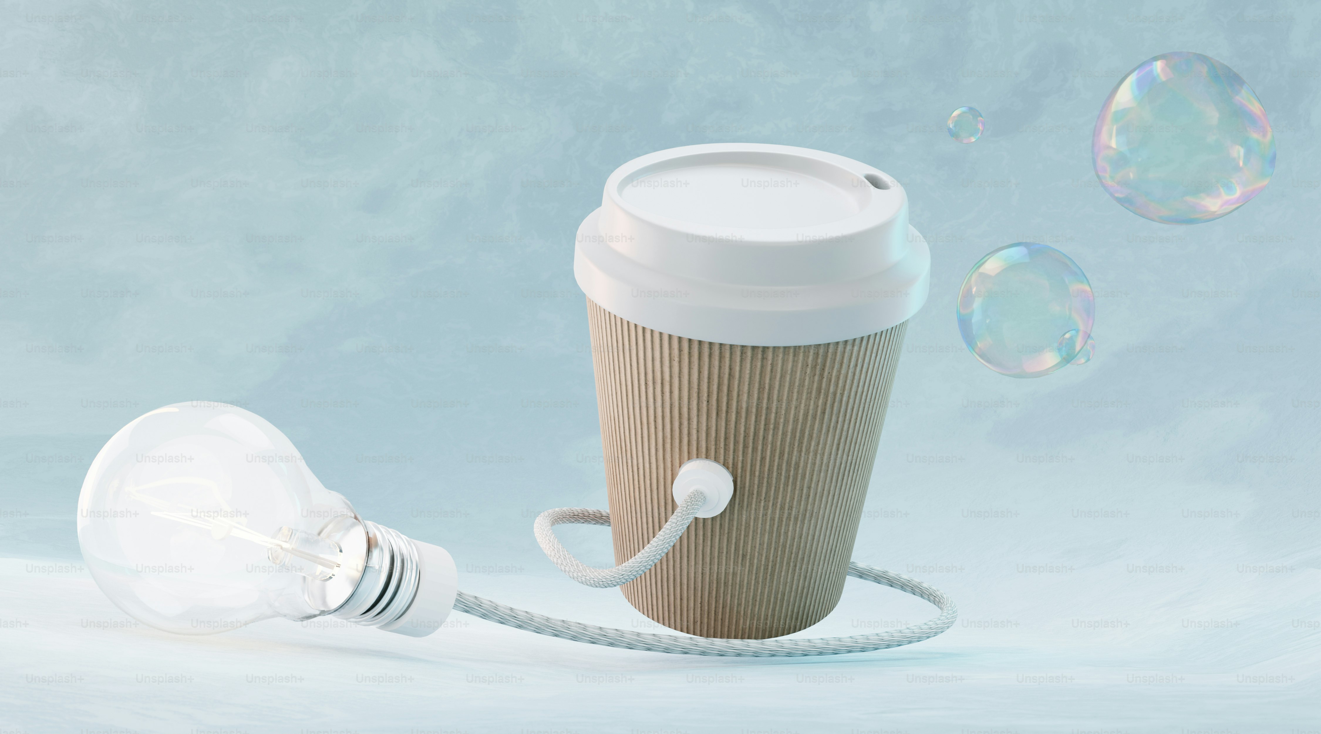 A cup of coffee next to a light bulb photo – Light bulb Image on Unsplash