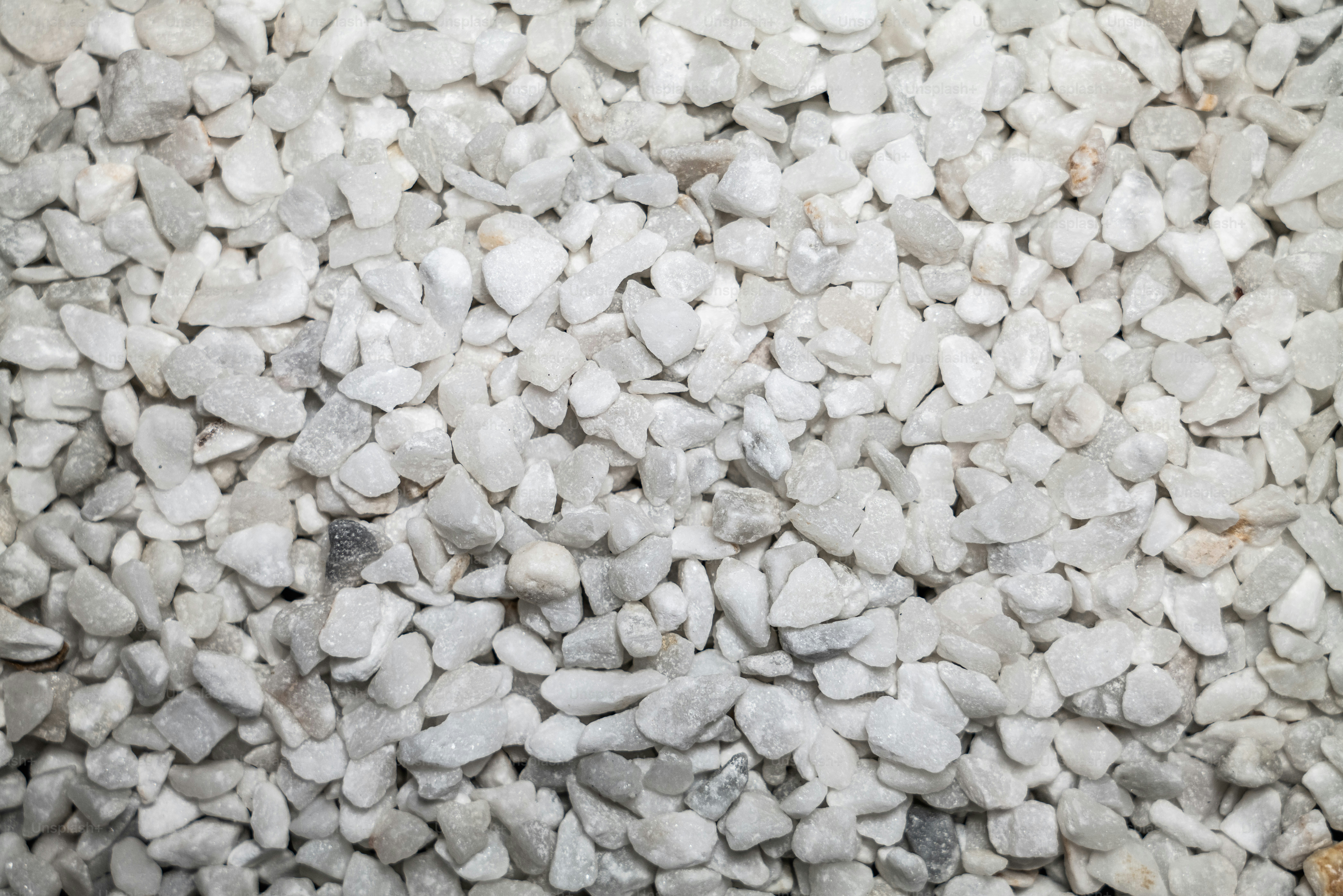 A pile of white rocks sitting next to each other photo – Gravel Image ...