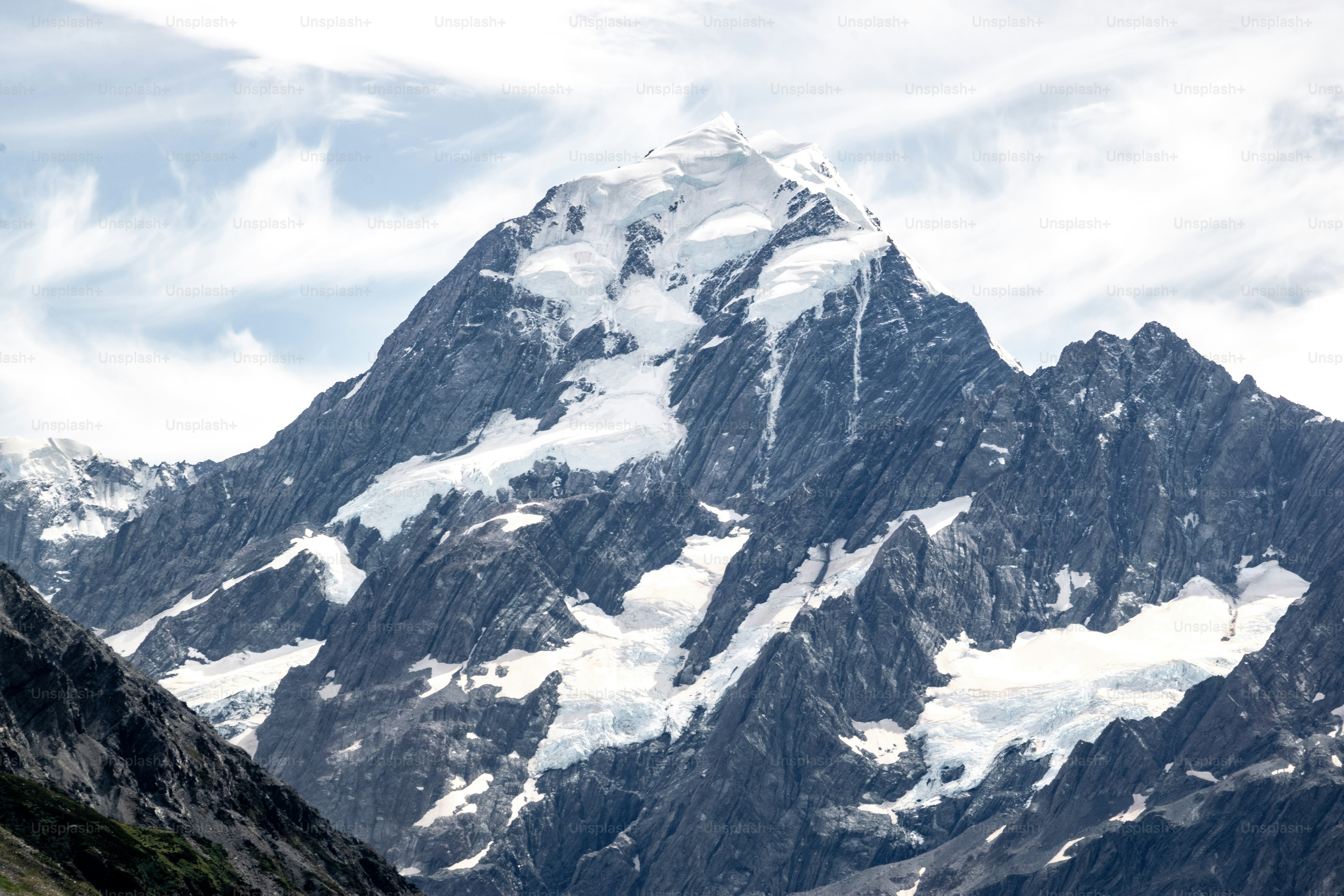 A very tall mountain with snow on it photo – Hooker valley track Image ...
