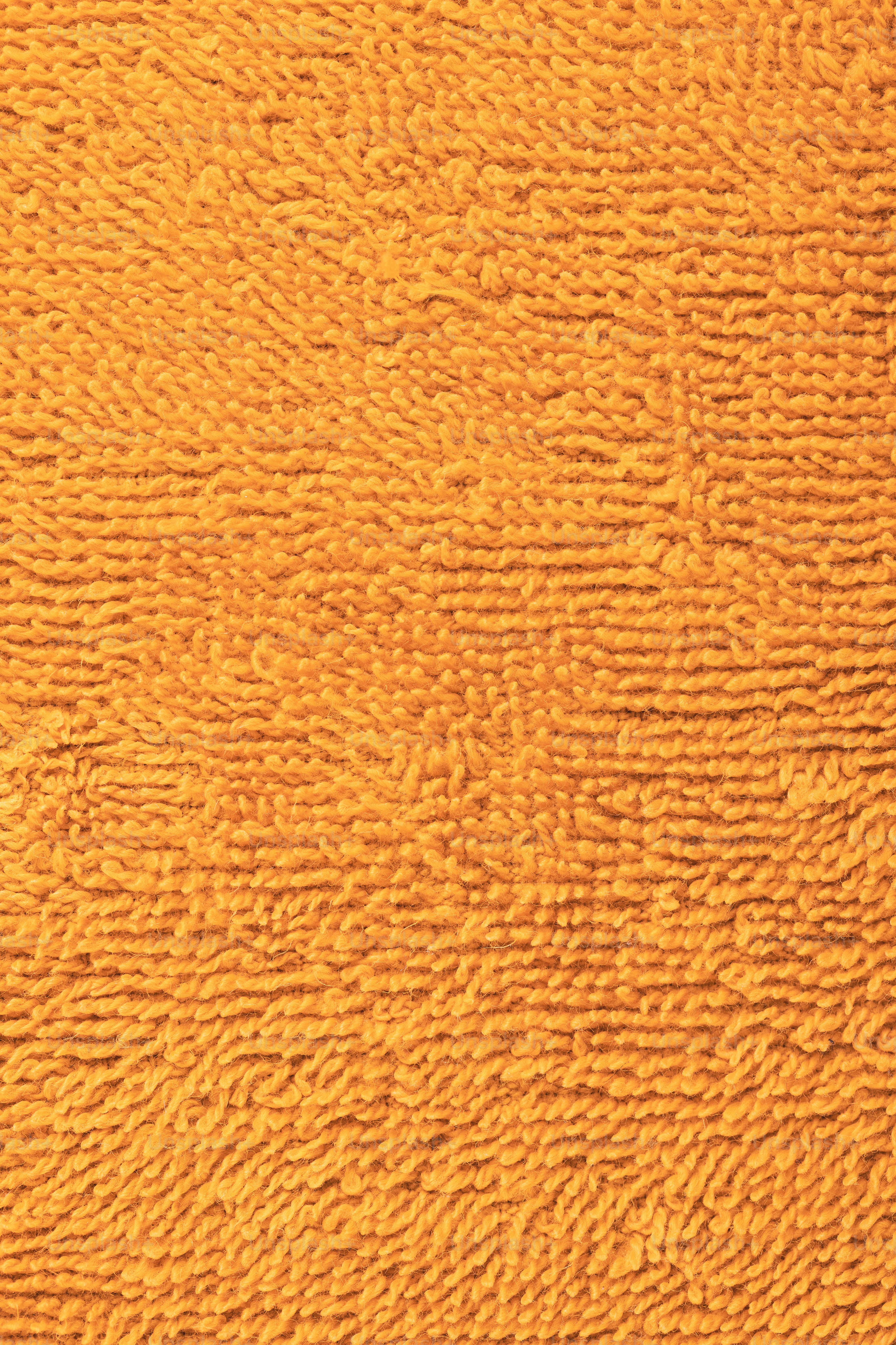 A close up of a textured orange wall photo – Burnt orange Image on Unsplash