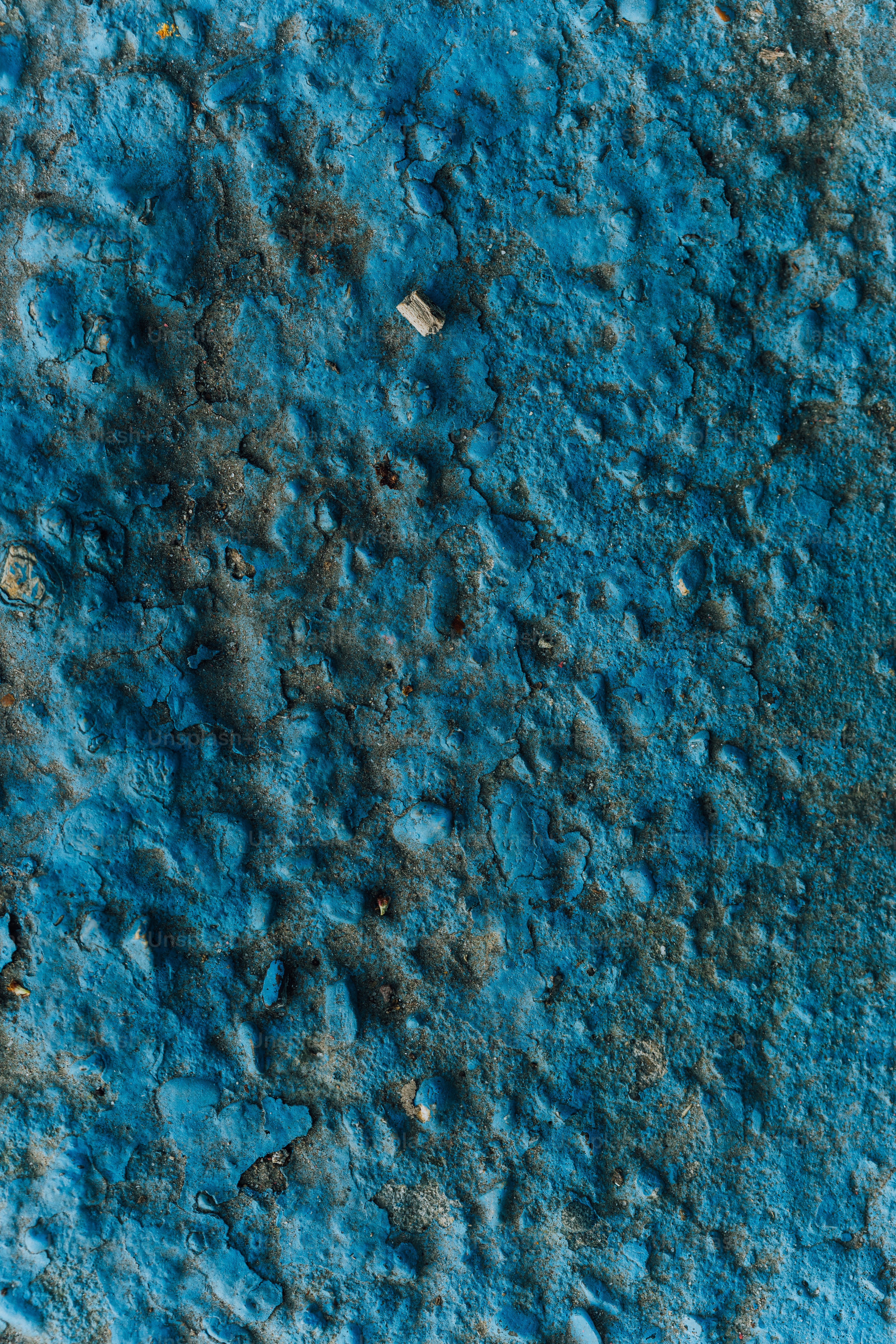 A close up of a blue surface with dirt photo – Painted concrete Image ...