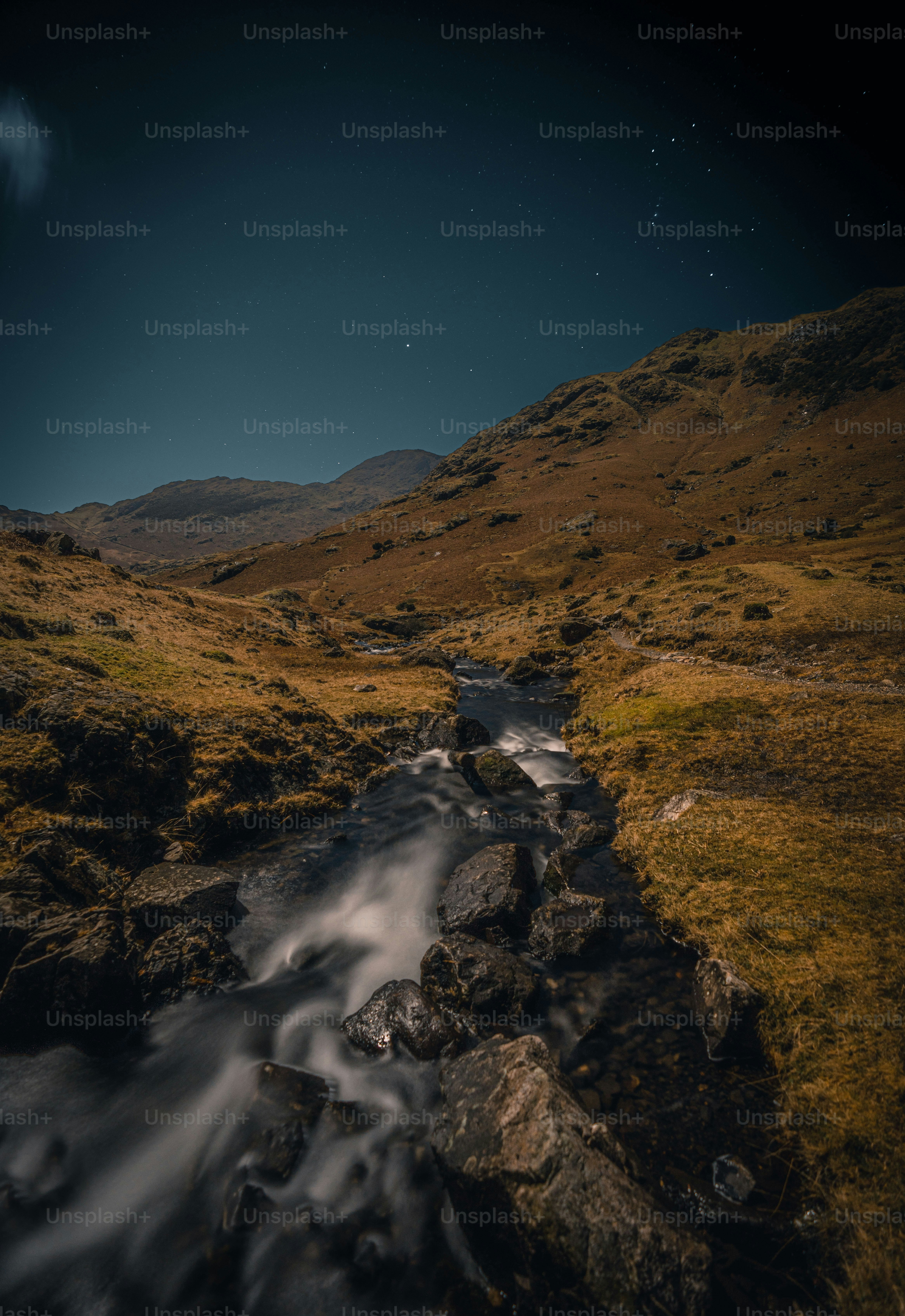 A stream running through a lush green hillside photo – Wallpapers Image ...