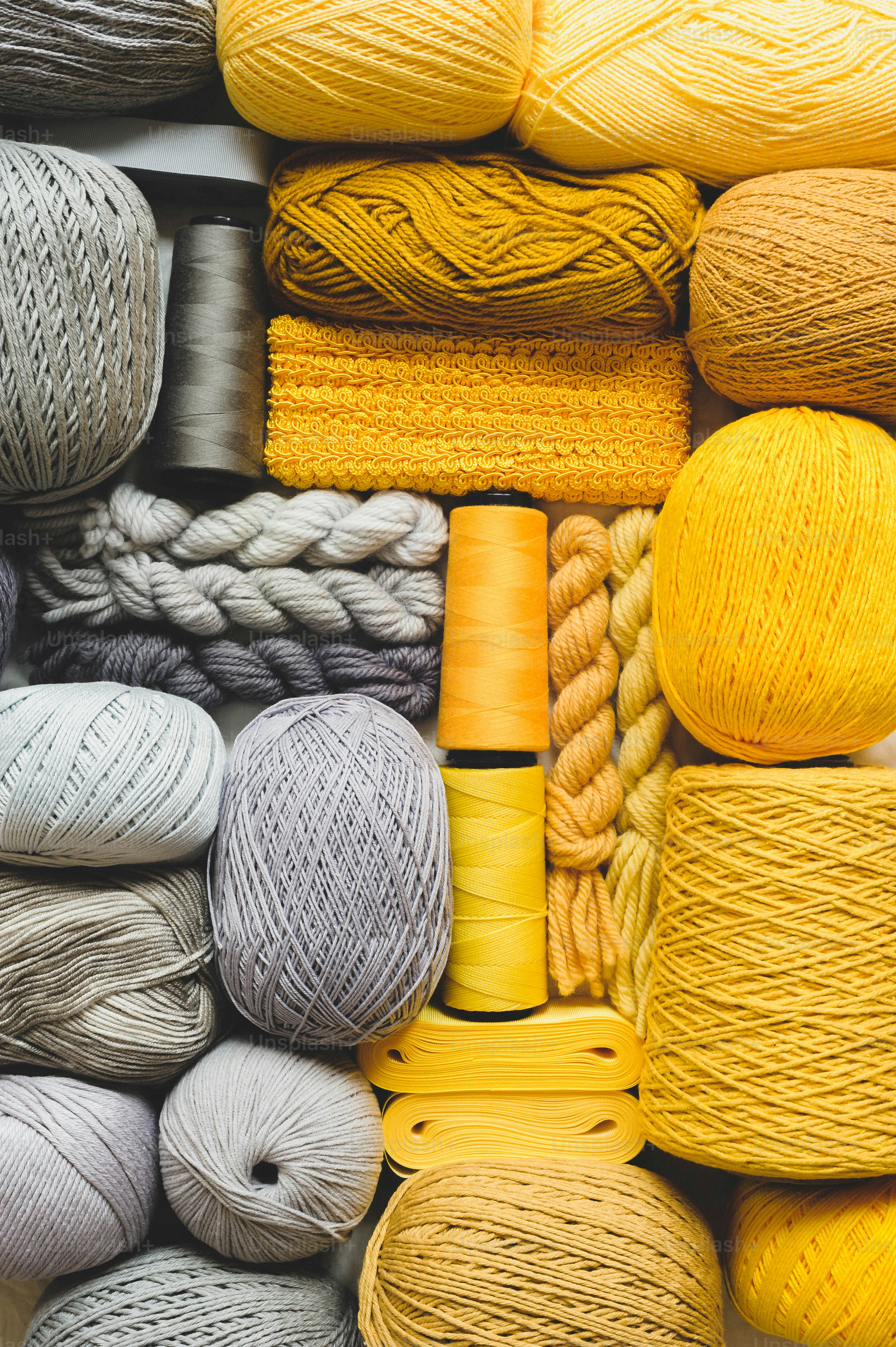 Many balls of yarn are stacked on top of each other photo – Wool Image ...