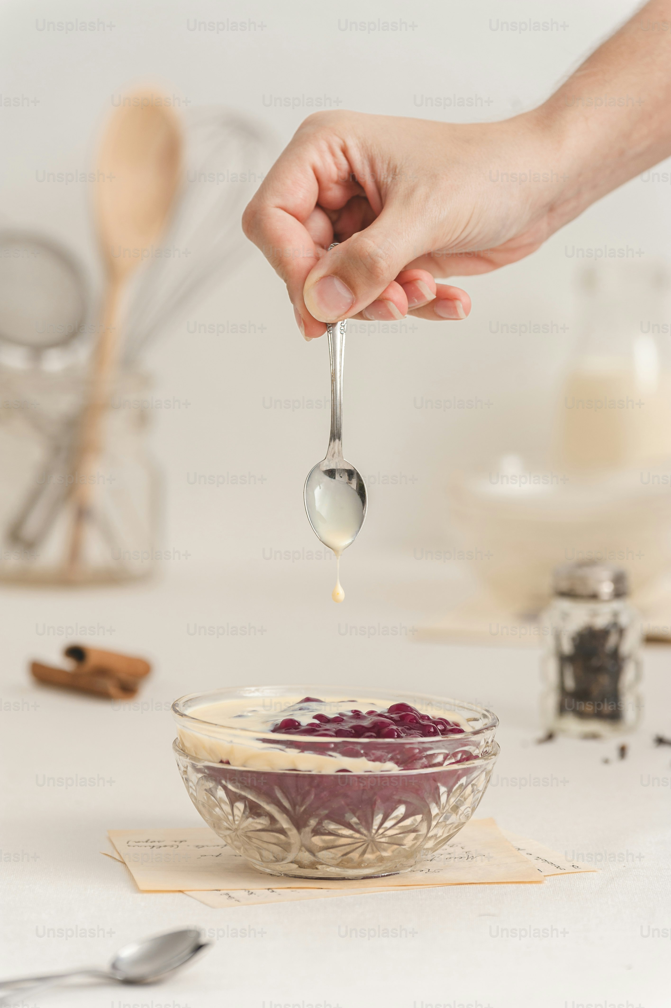 A person holding a spoon over a bowl of food photo – Food Image on Unsplash
