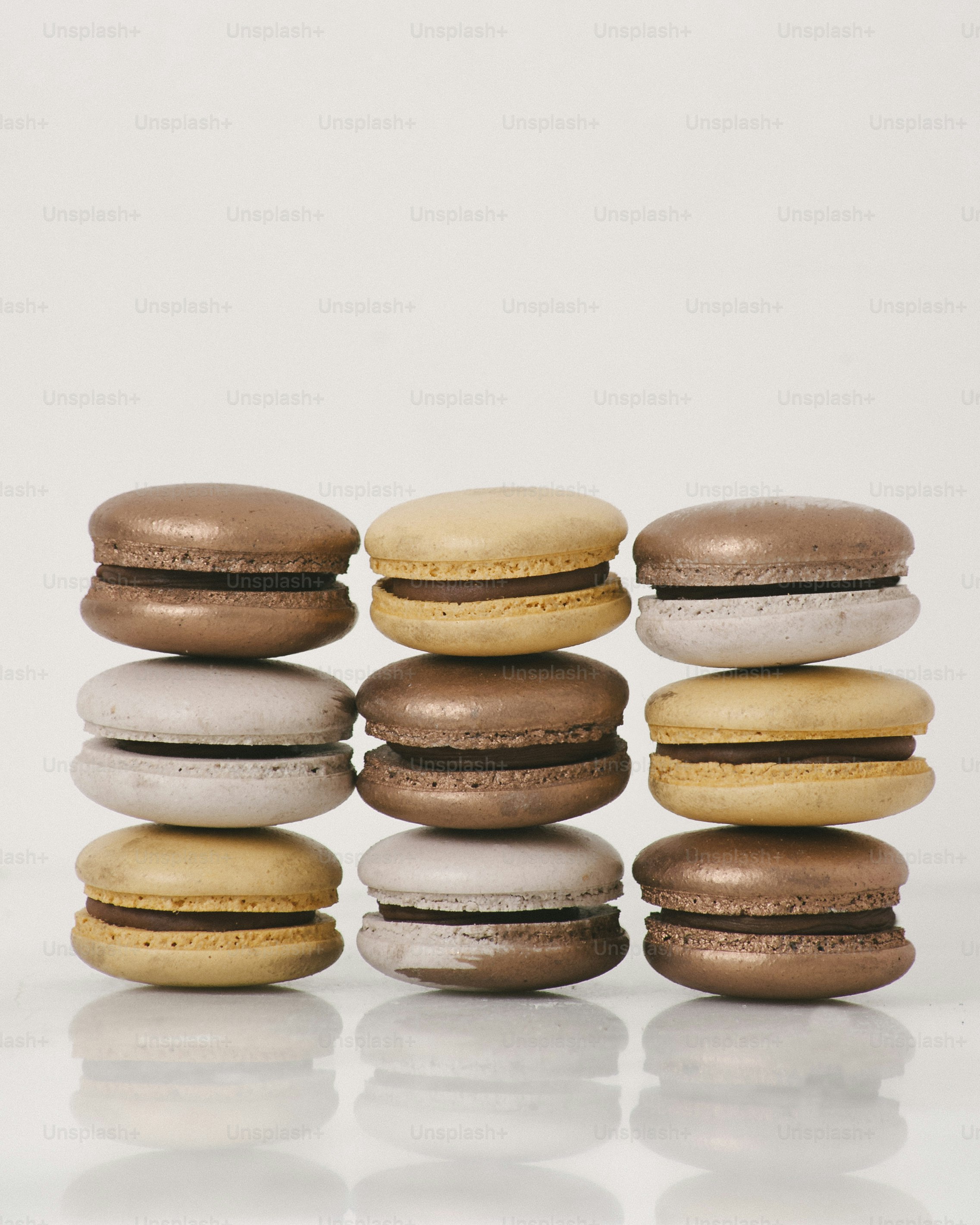 A stack of macaroons sitting on top of each other photo – Bakery Image ...