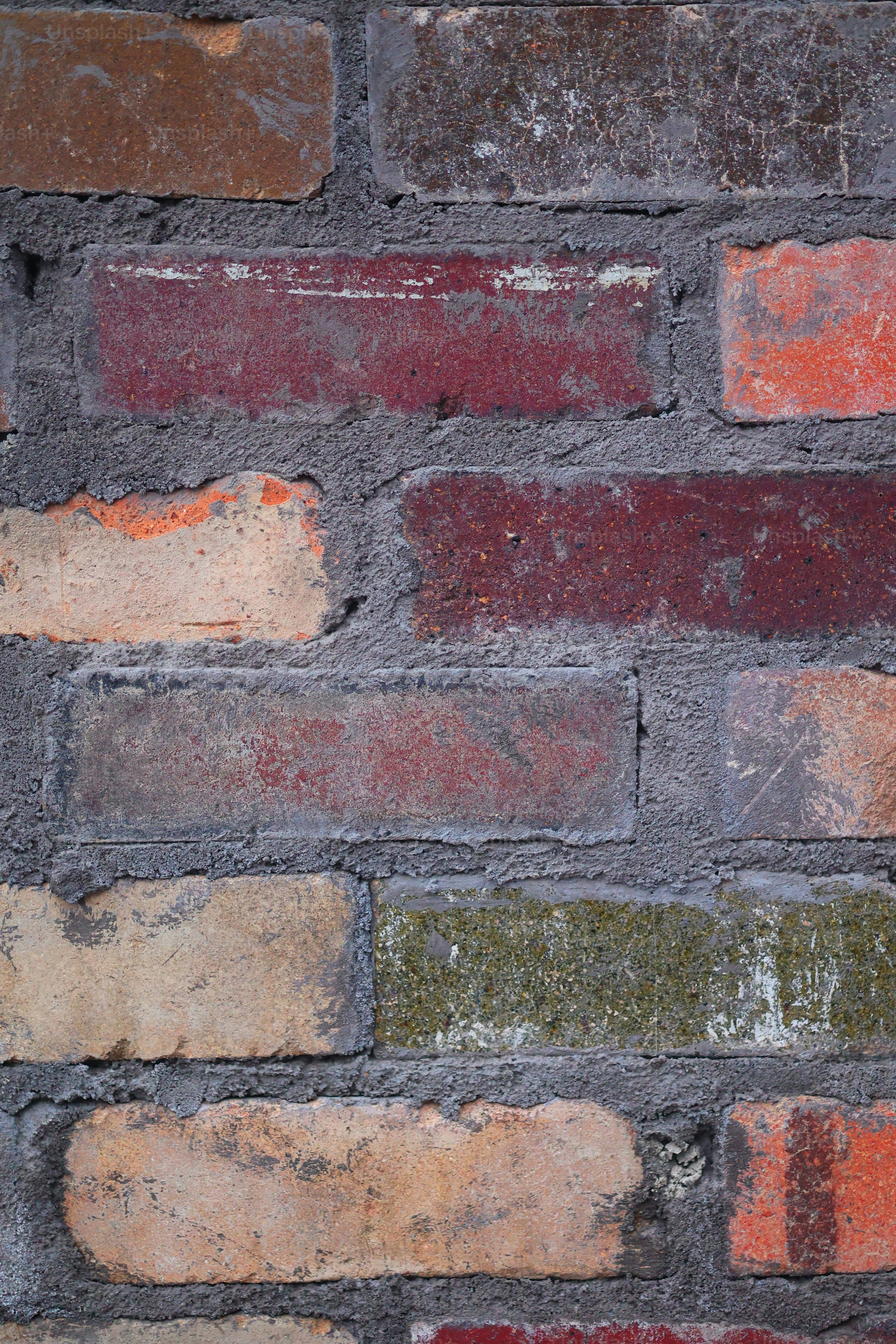 A close up of a brick wall made of bricks photo – Texture Image on Unsplash