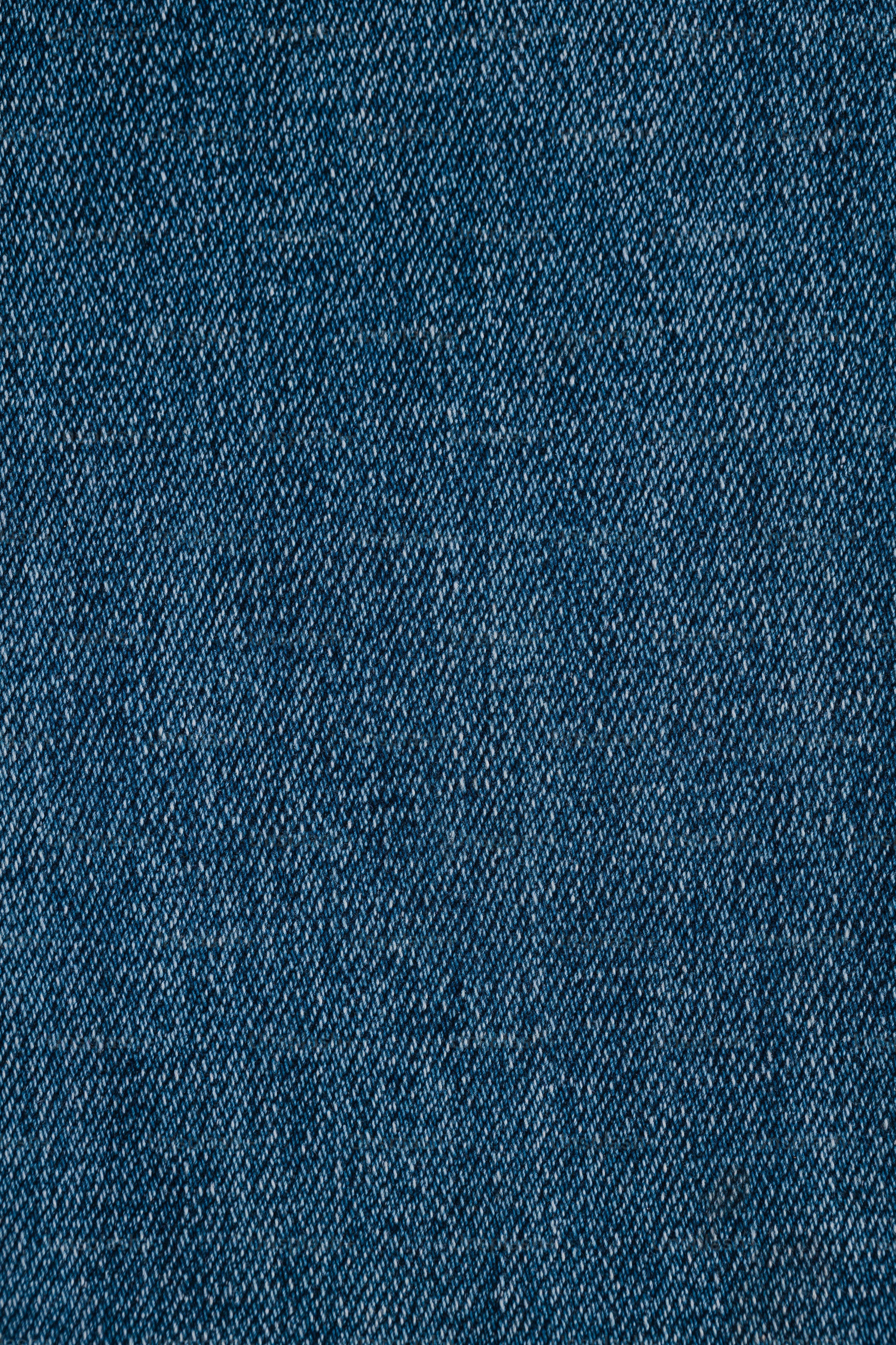 A close up of a blue denim fabric texture photo – Denim Image on Unsplash