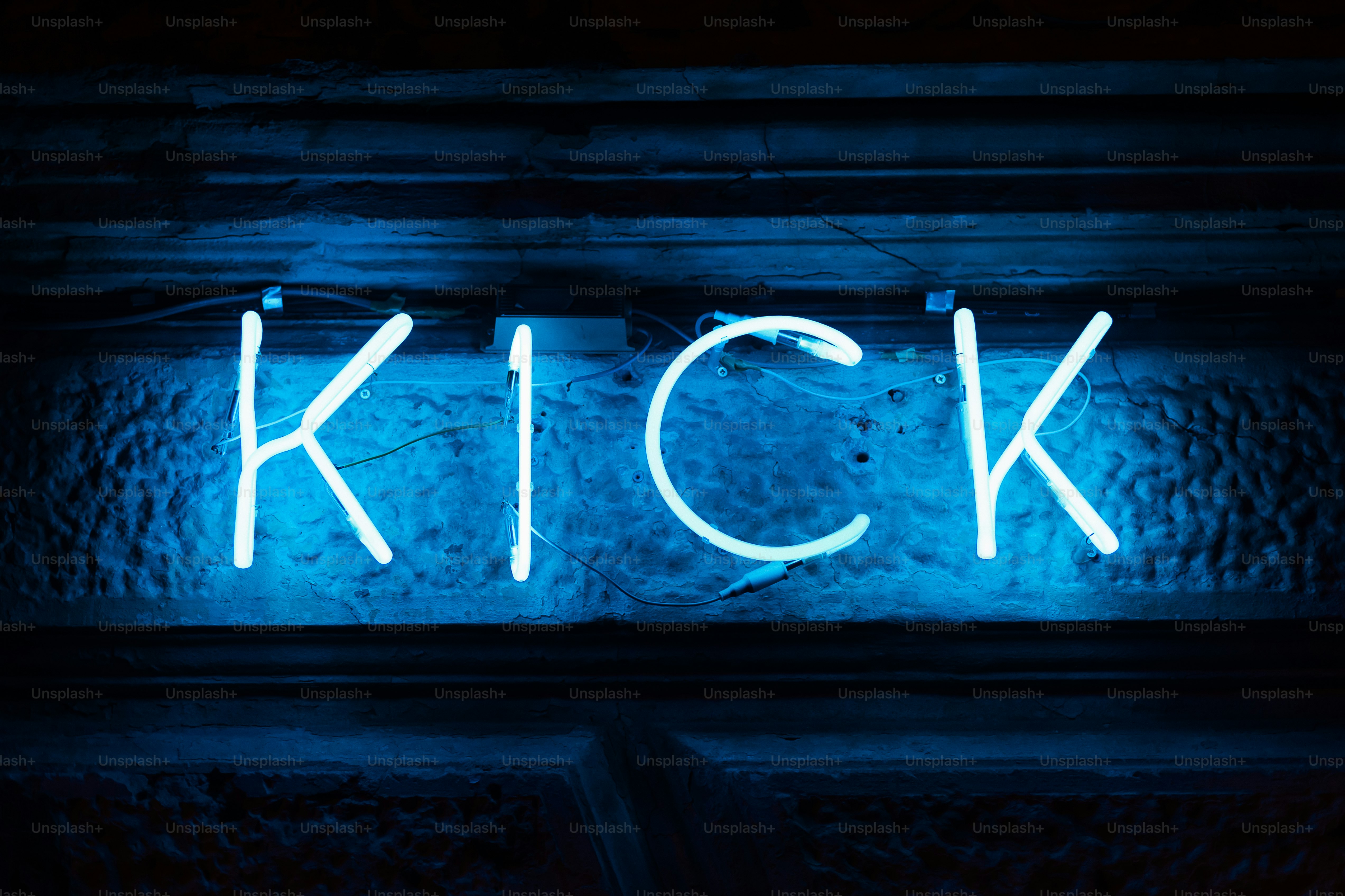 A neon sign that reads kick on a wall photo – Neon Image on Unsplash