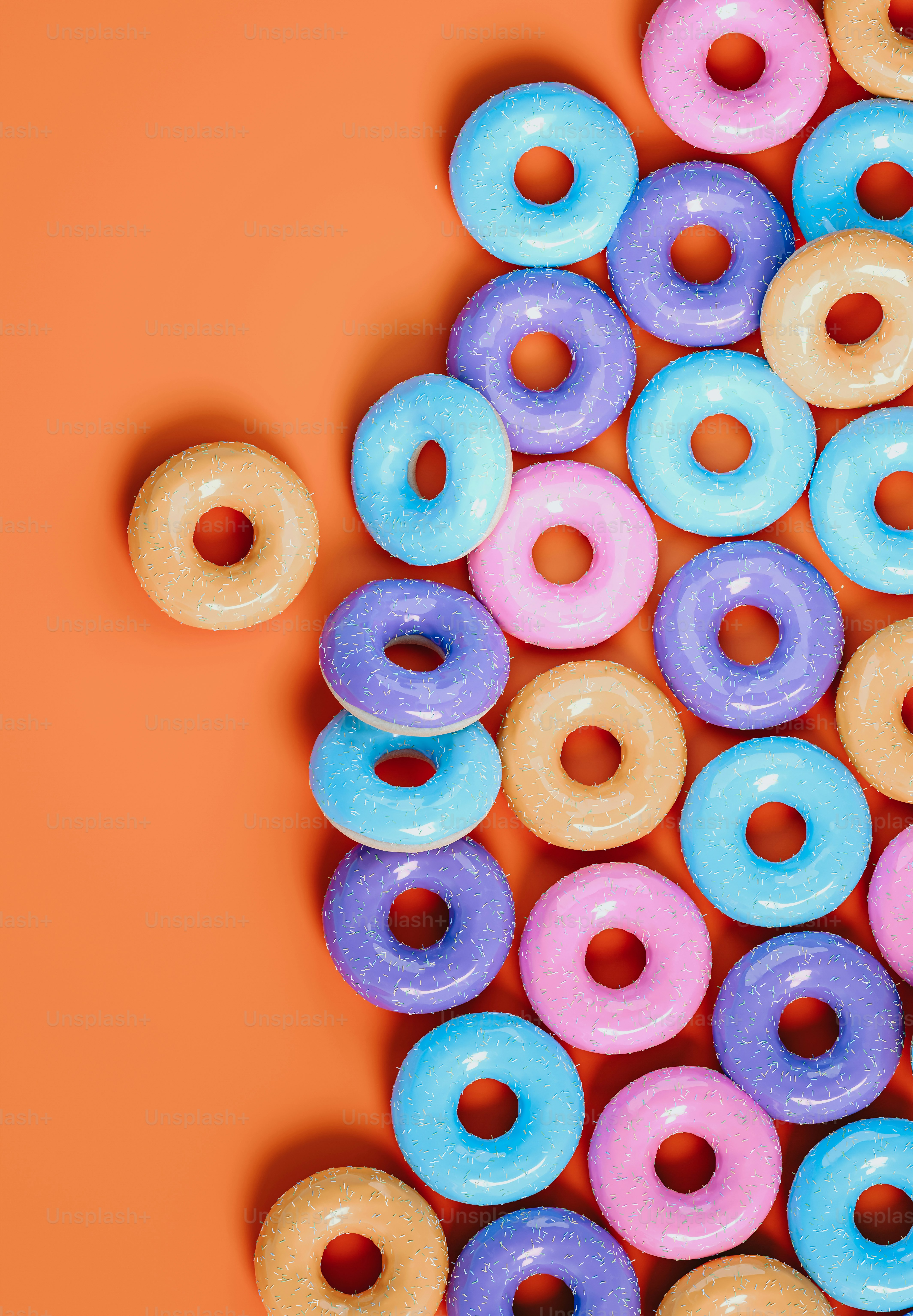 A pile of donuts sitting on top of a table photo – Donut Image on Unsplash