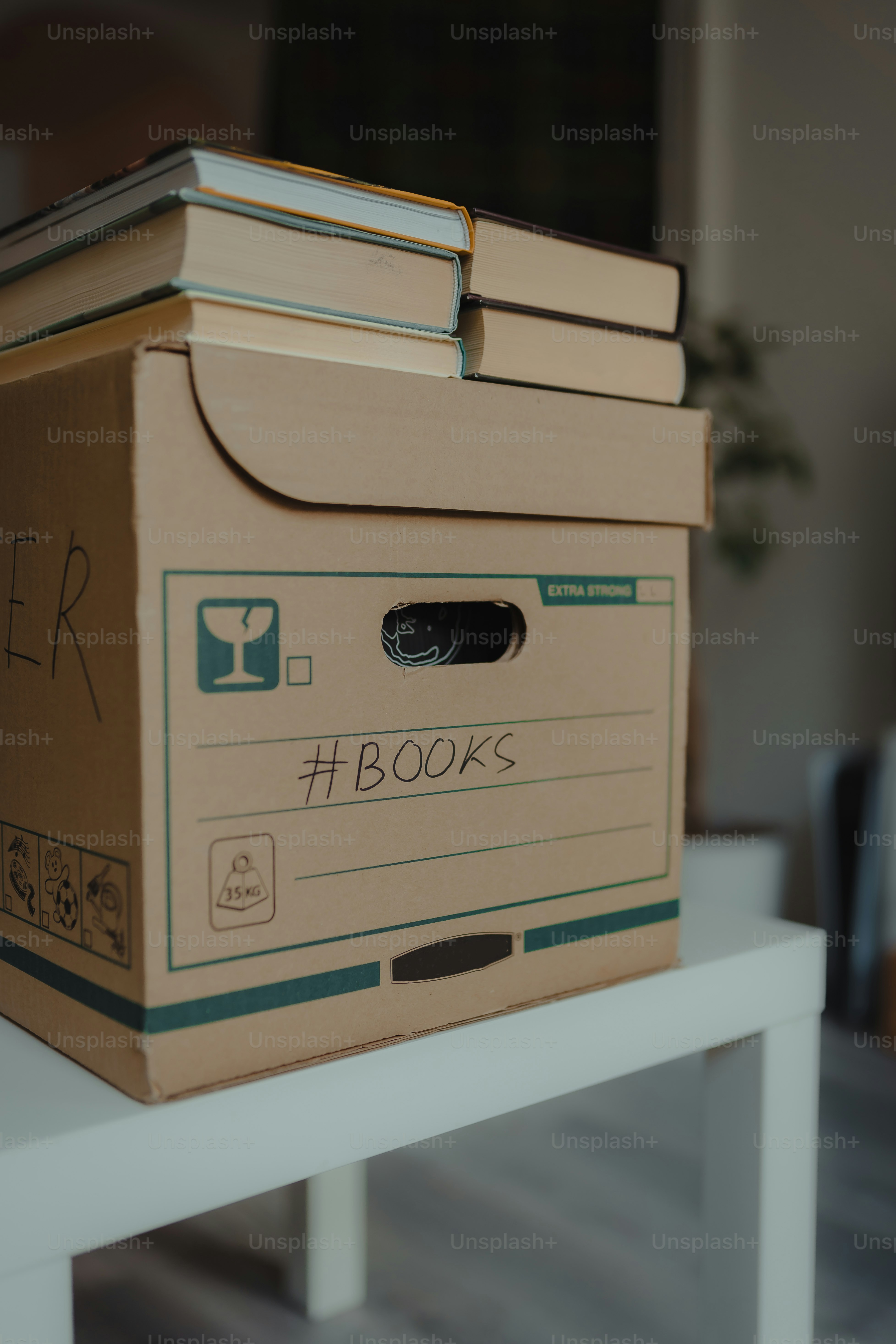 A stack of books sitting on top of a table photo – Old books Image on ...