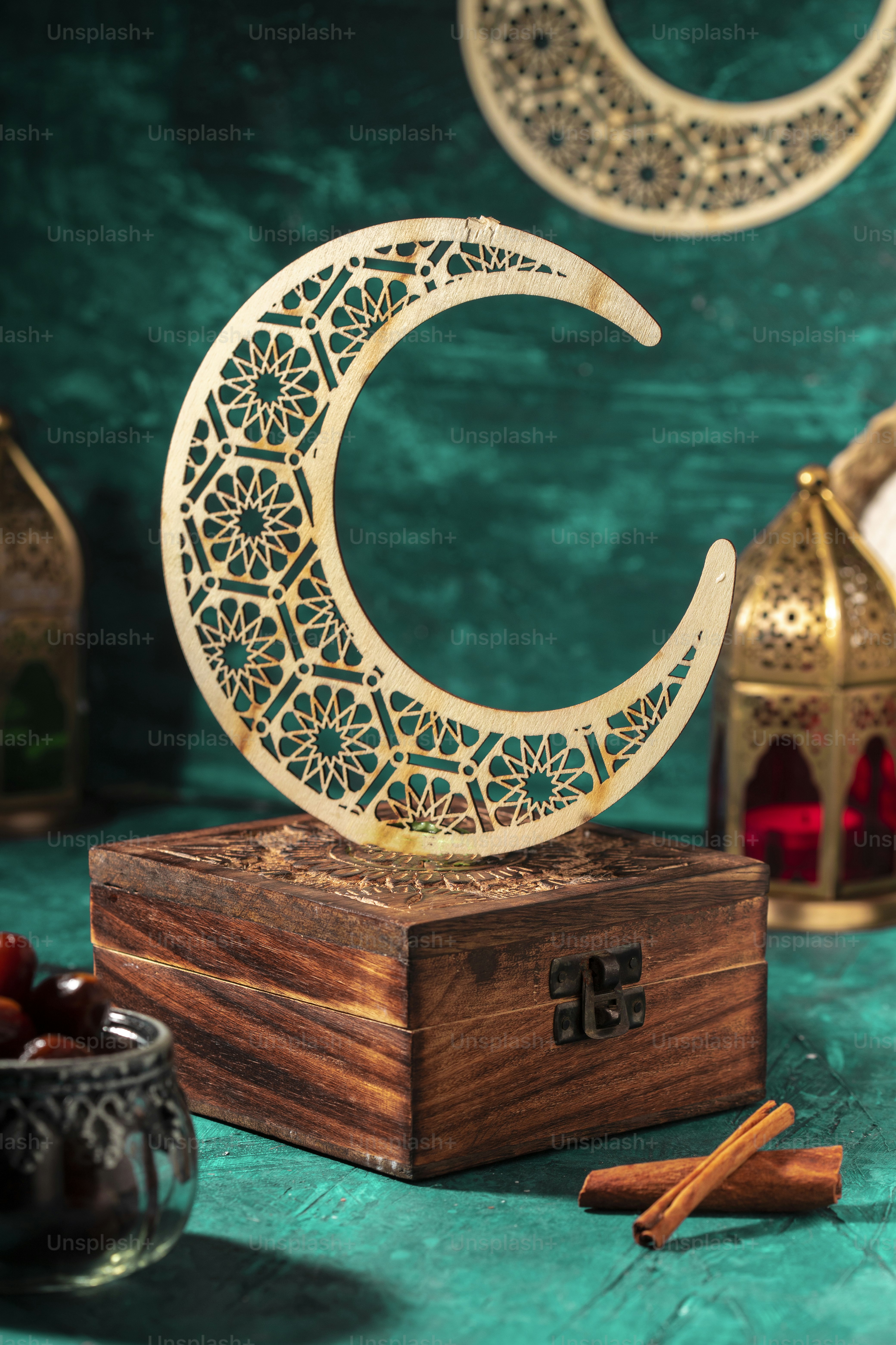 A wooden box with a carved crescent on top of it photo – Islam Image on ...