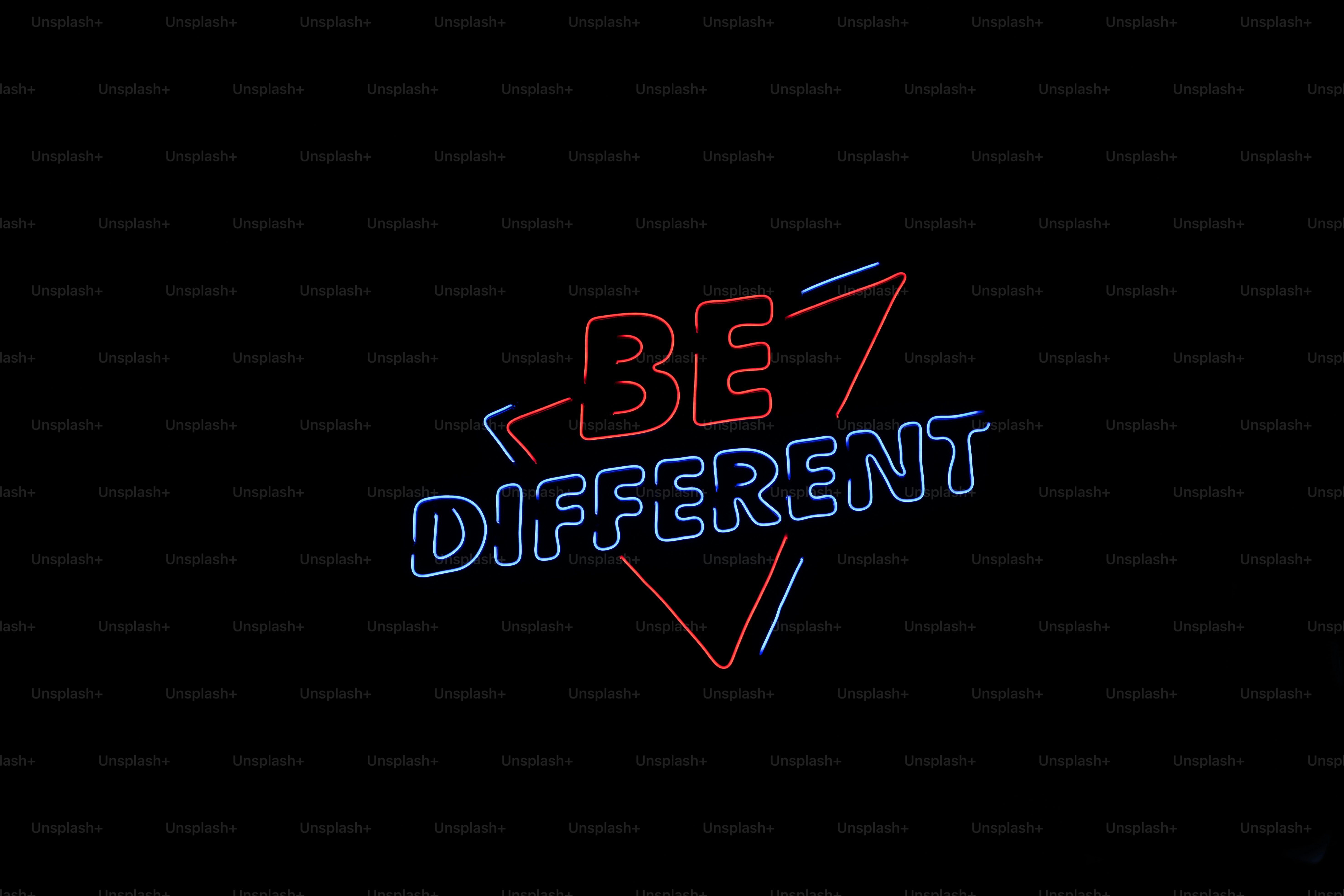 A neon sign that says be different photo – Logo Image on Unsplash
