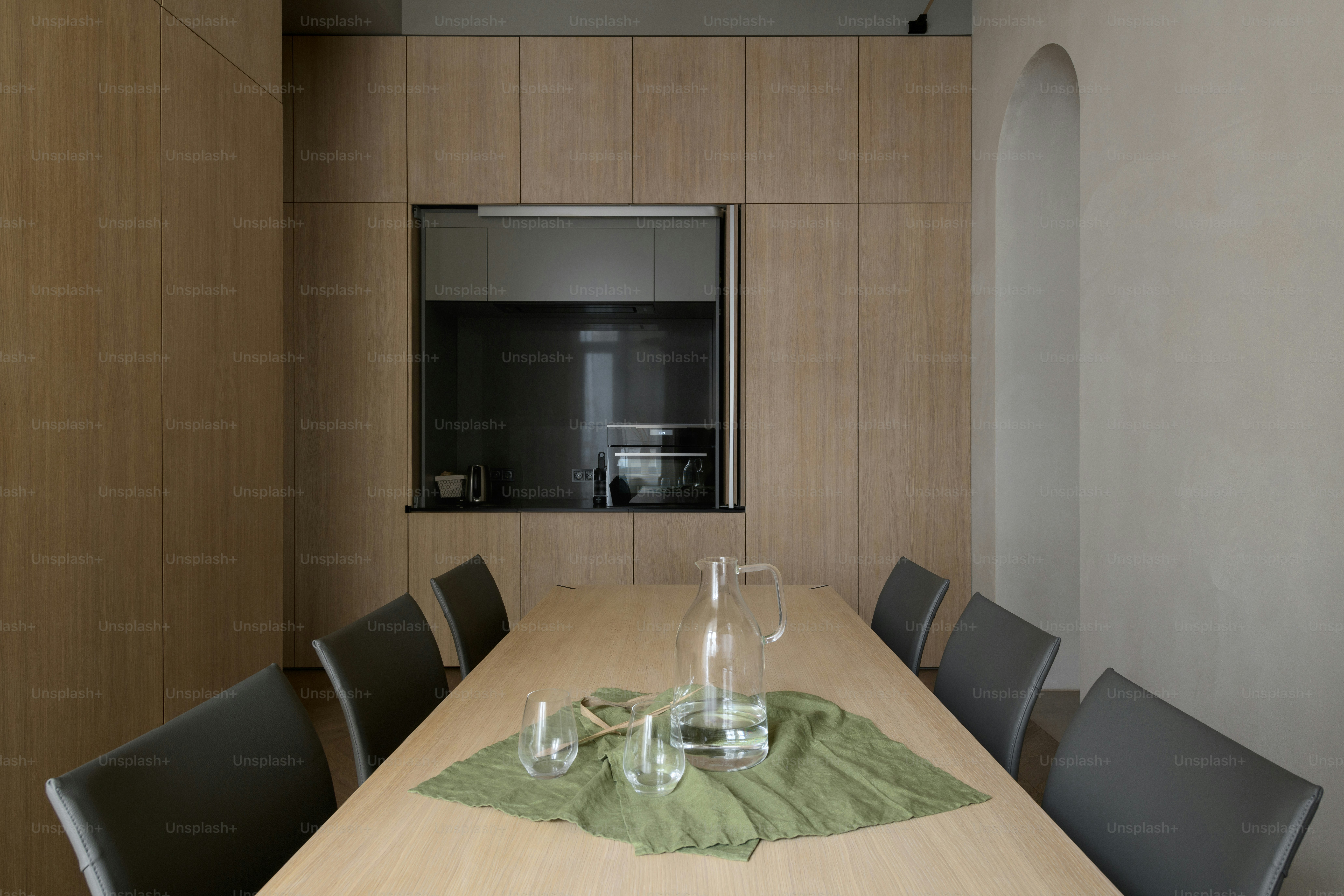 A table with a green cloth on top of it photo – Dining table Image on ...