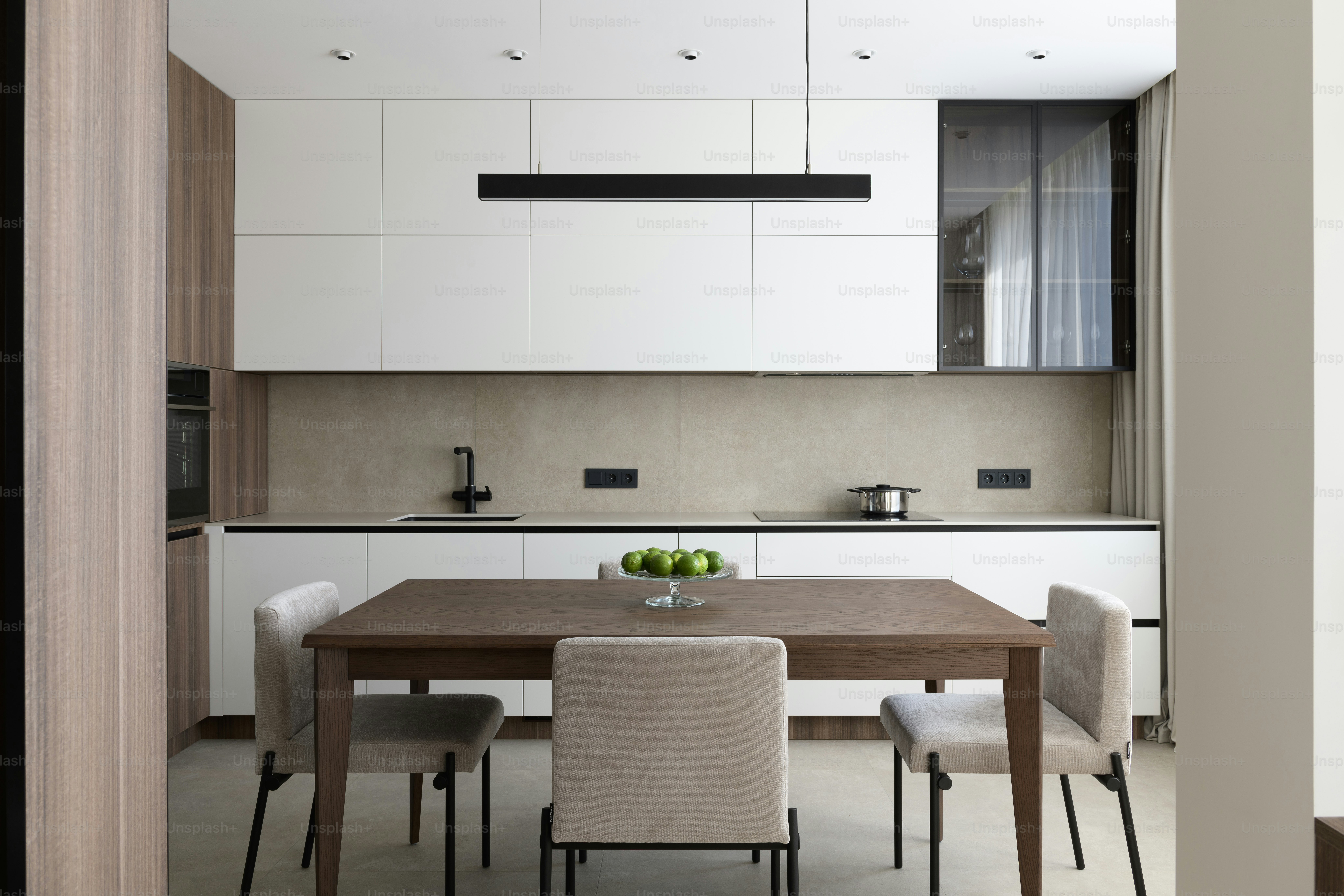 A kitchen with a table and chairs and a sink photo – Home Image on Unsplash