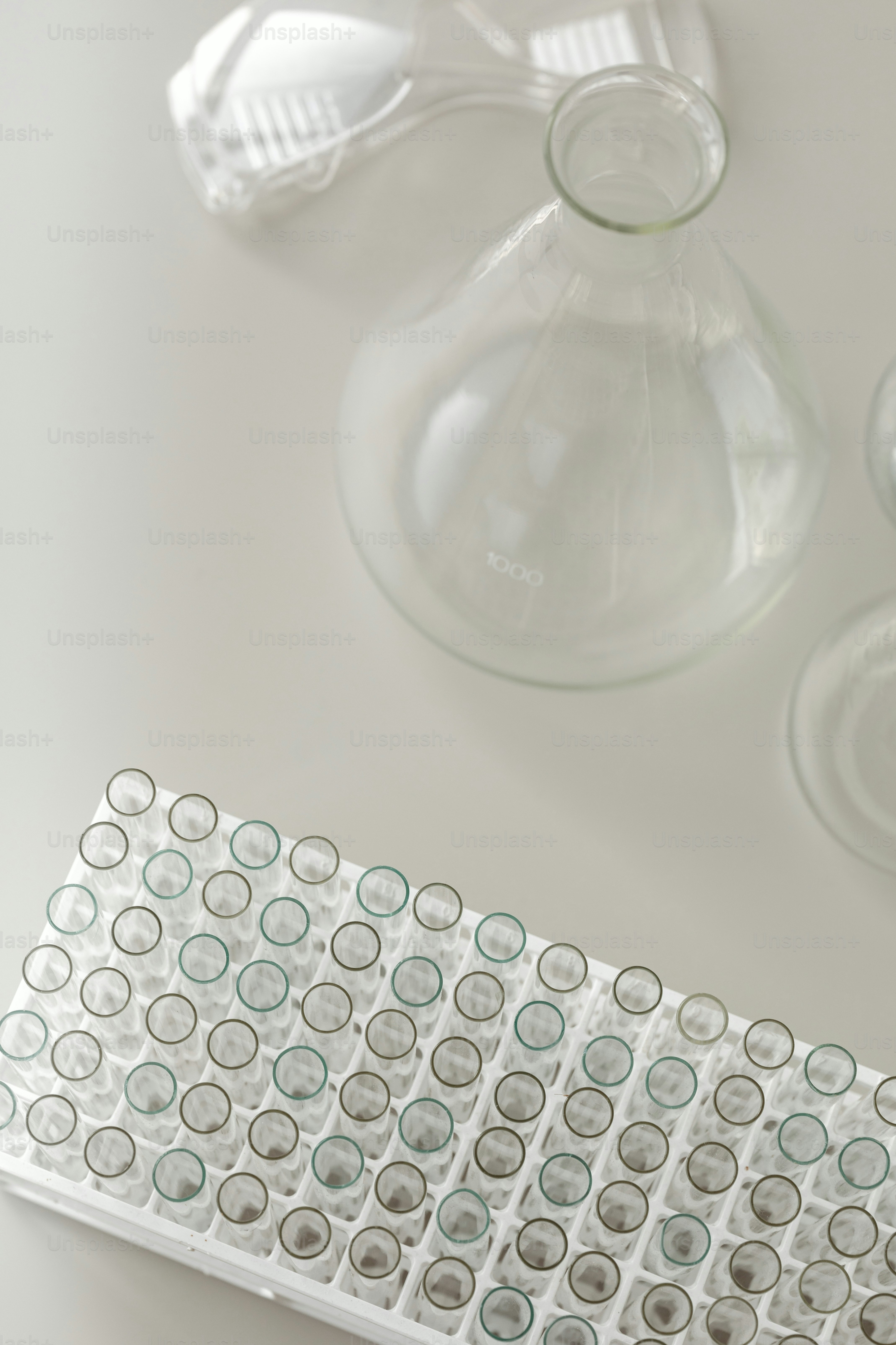 A close up of a keyboard near a bottle of liquid photo – Test tubes ...