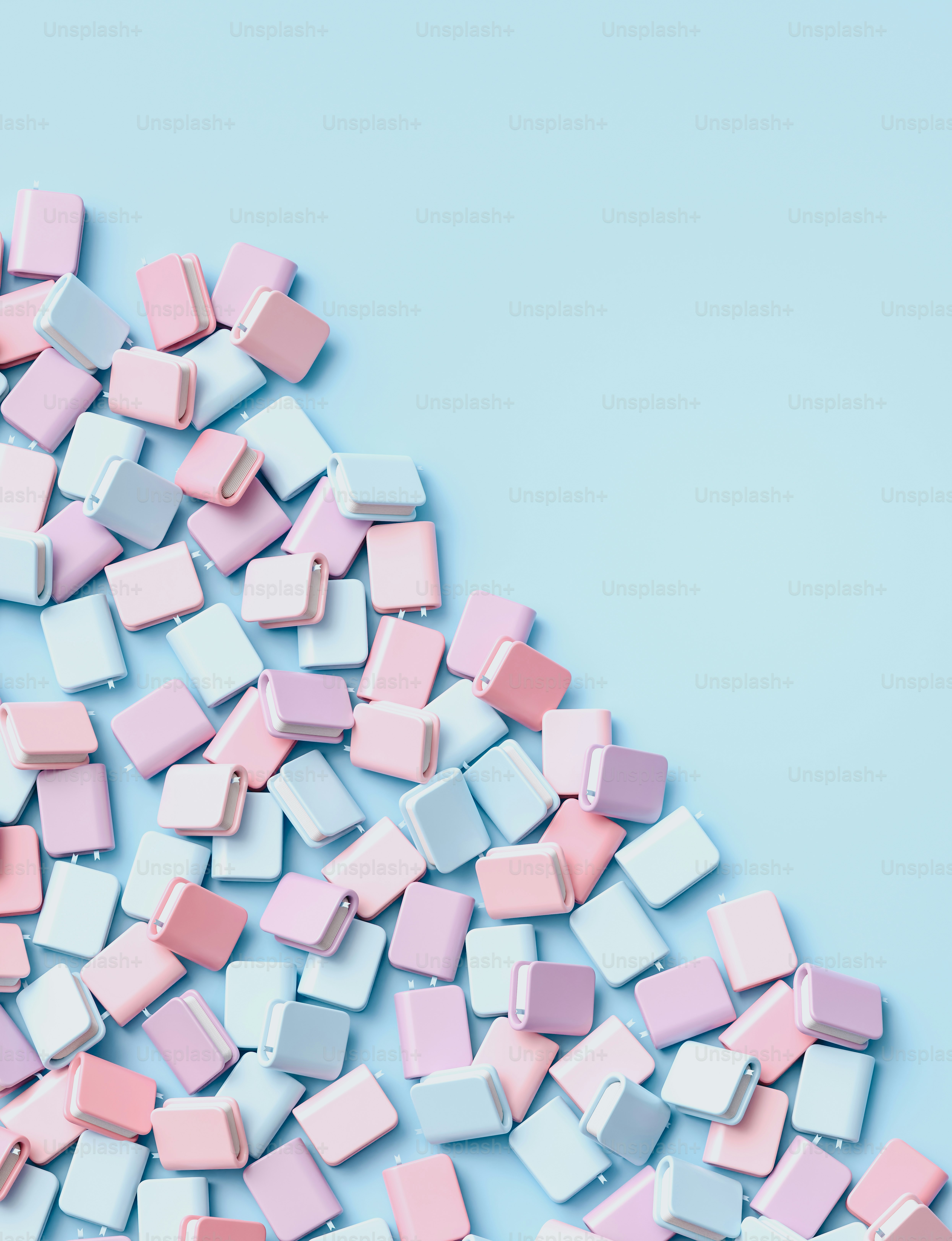 A pile of pastel colored cubes on a blue background photo – Bookworm ...