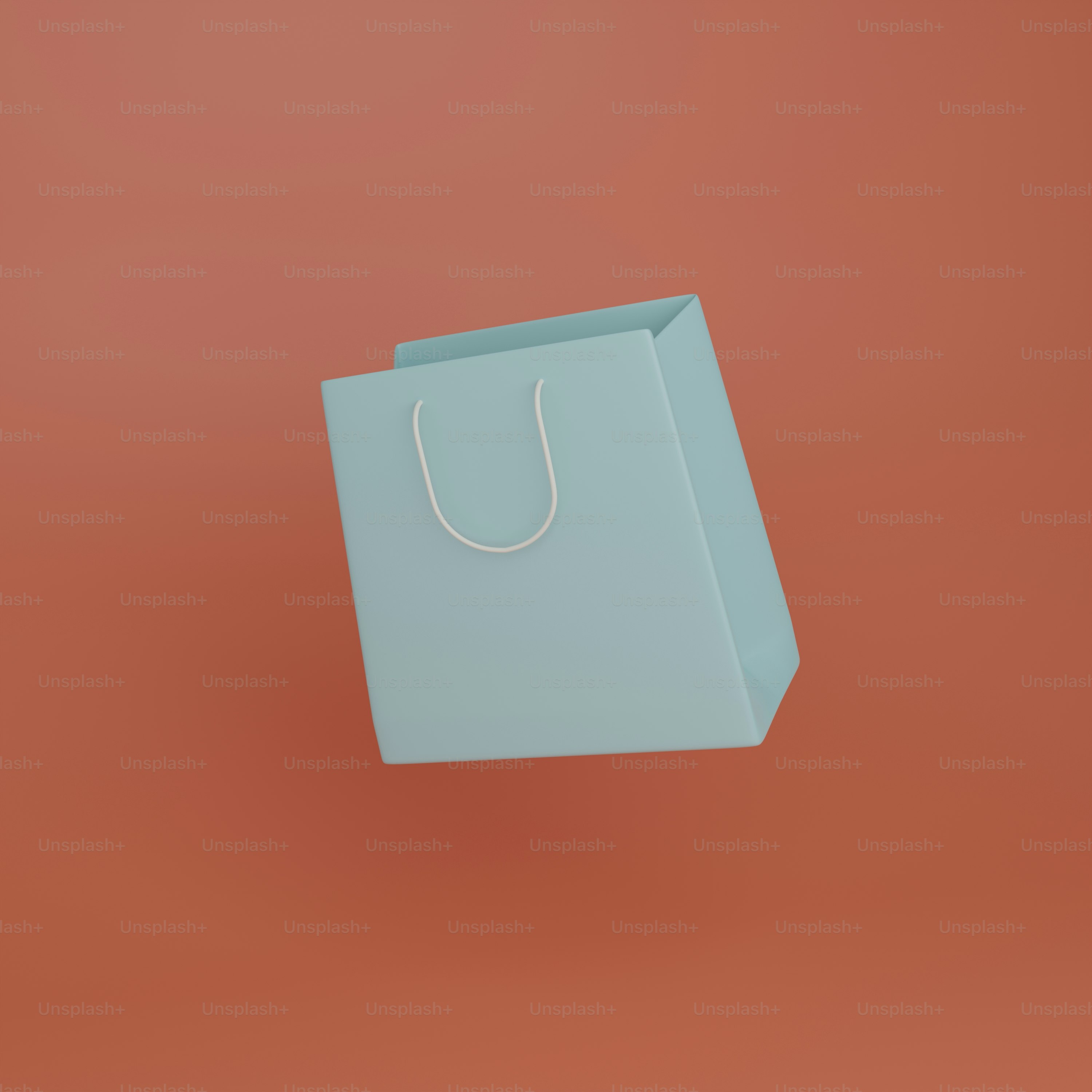 A blue paper bag with a white string hanging from it photo – Bag Image ...