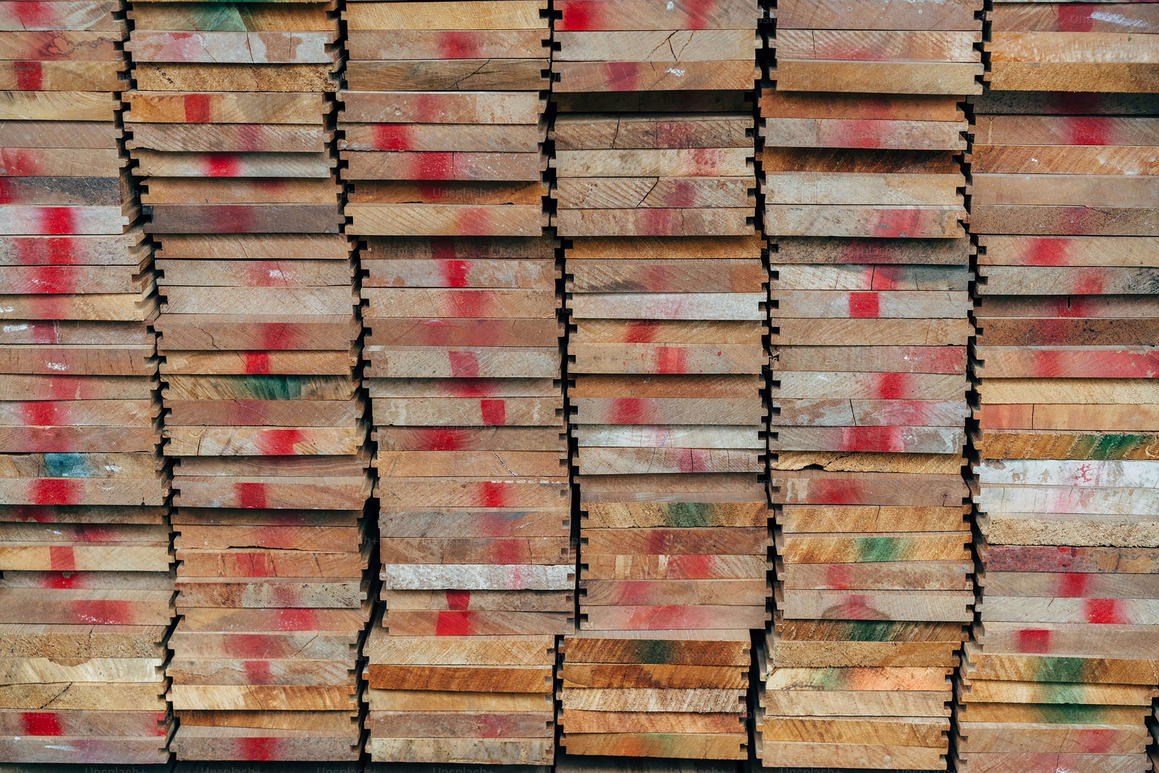 A stack of wooden boards stacked on top of each other photo – Bangkok ...