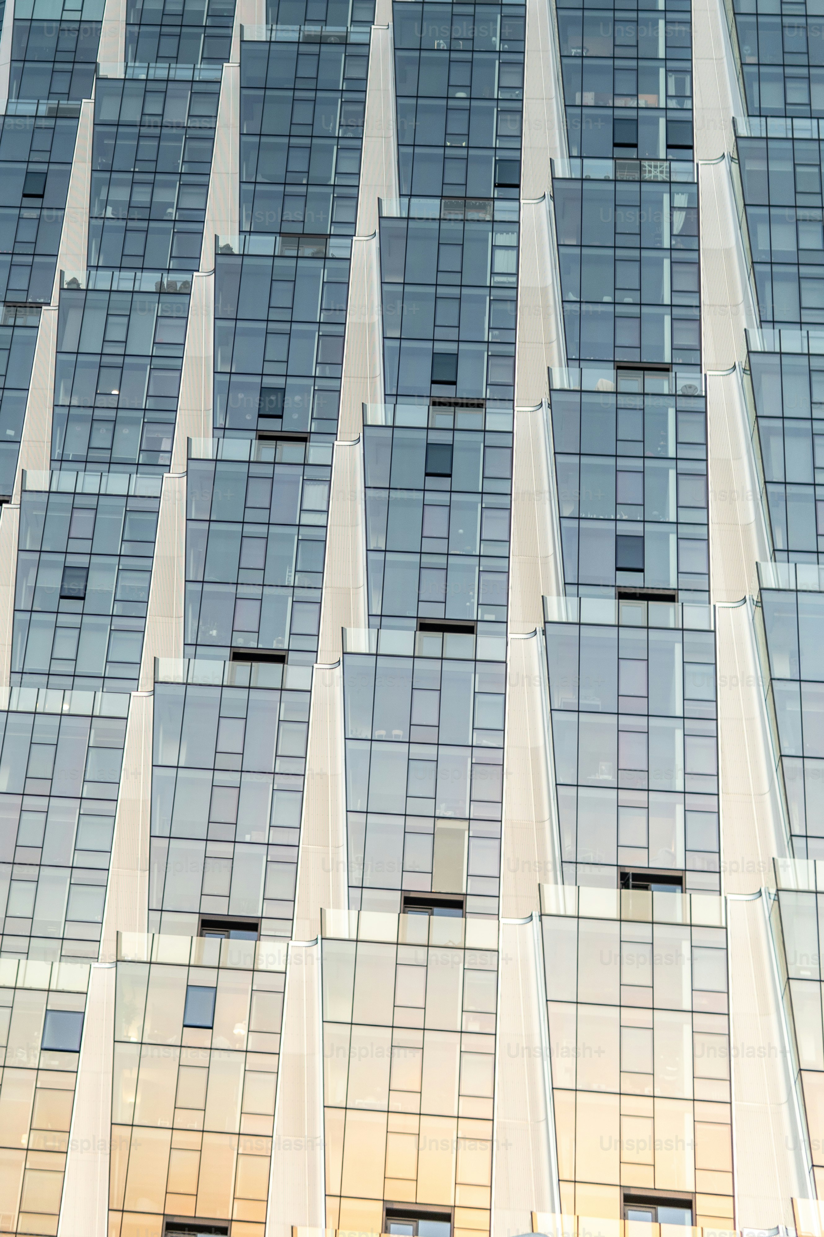A close up of a building with many windows photo – Building Image on ...