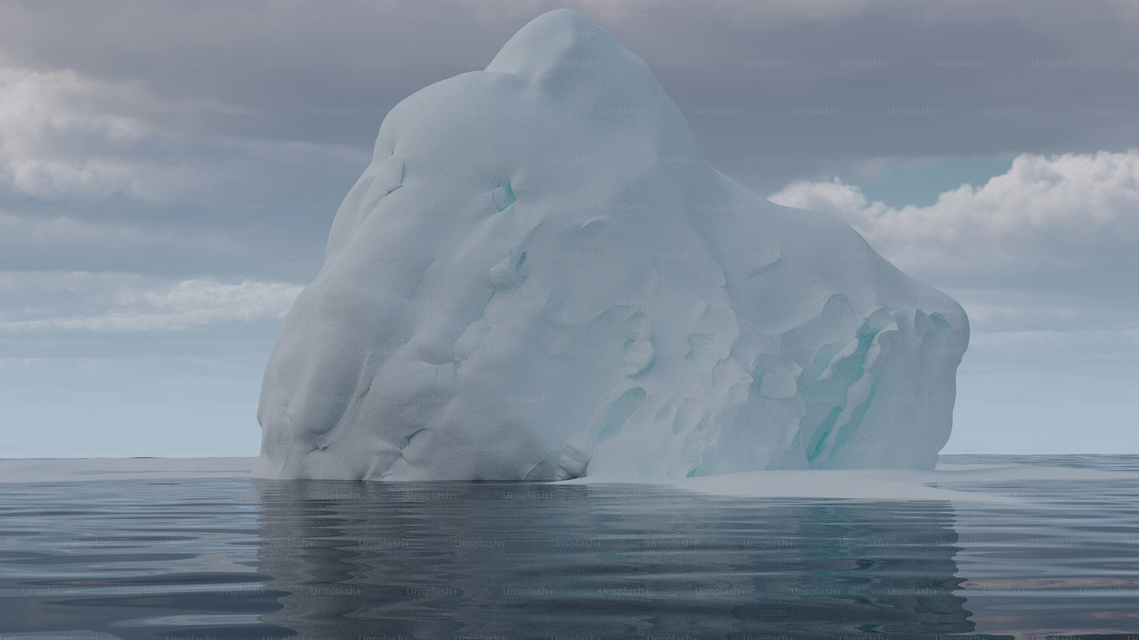 A large iceberg floating on top of a body of water photo – Screensaver ...