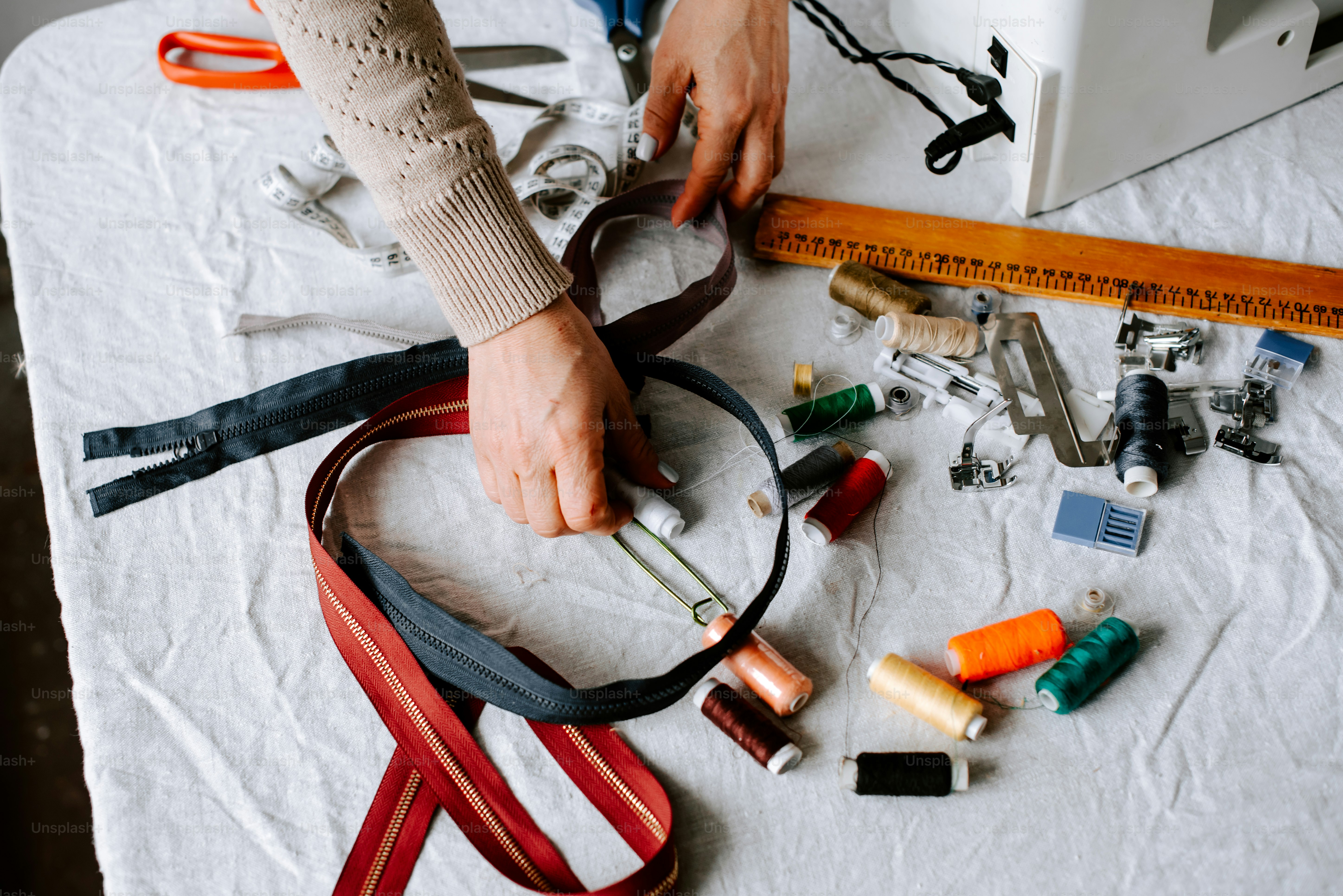 A sewing machine sitting on top of a white table photo – Professional ...