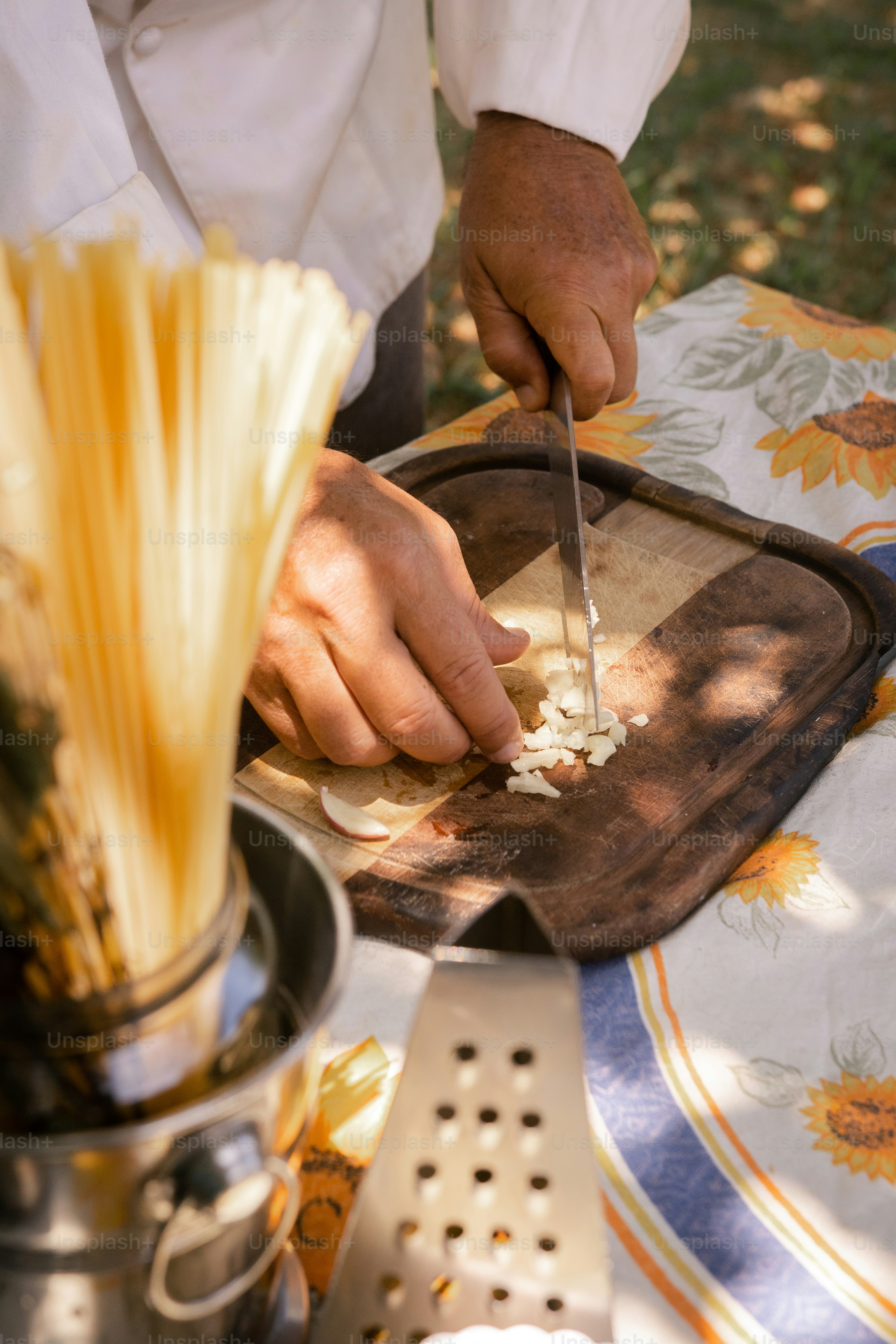 A person cutting up food on top of a table photo – Garden Image on Unsplash