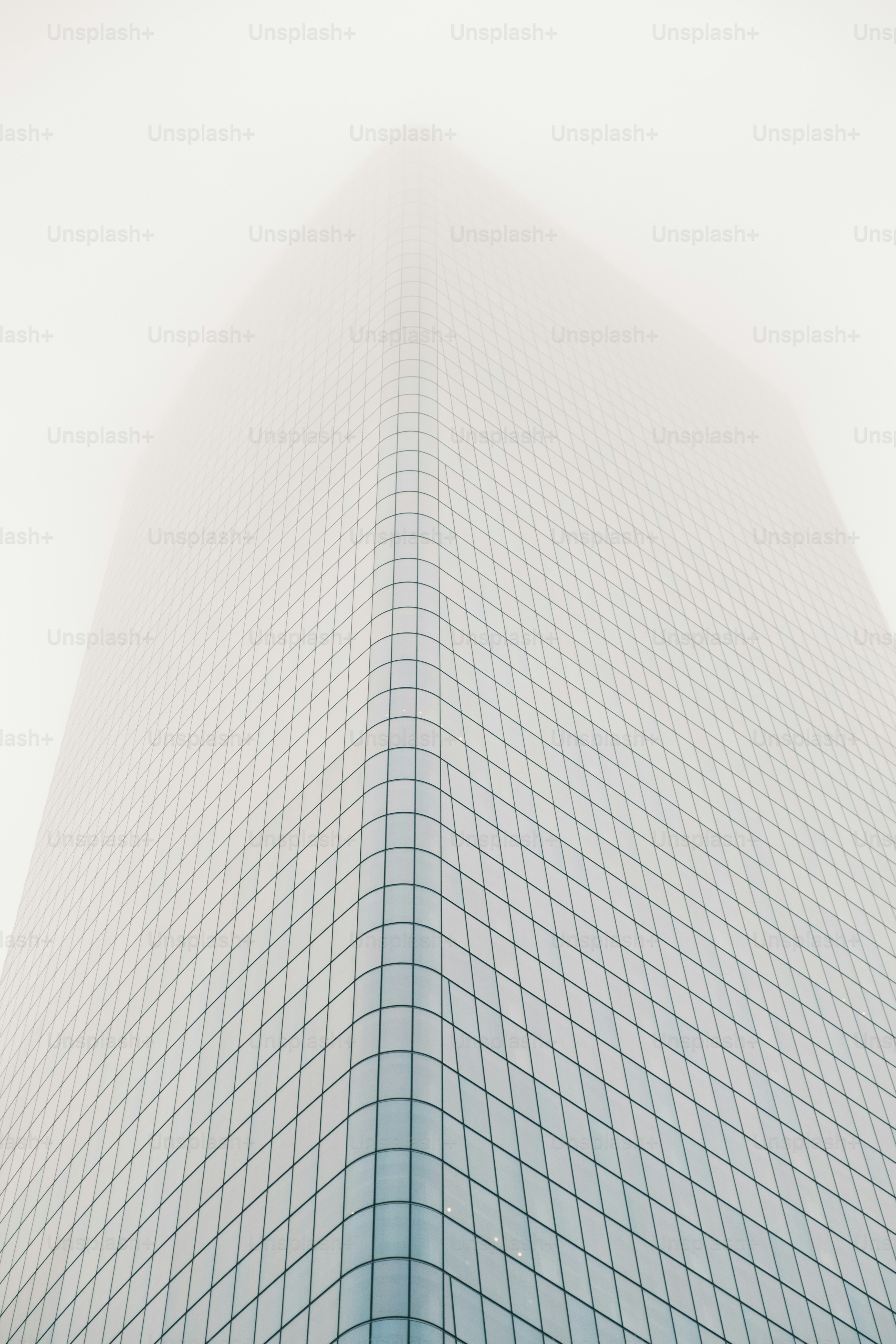 A very tall building with a lot of windows photo – Building Image on ...