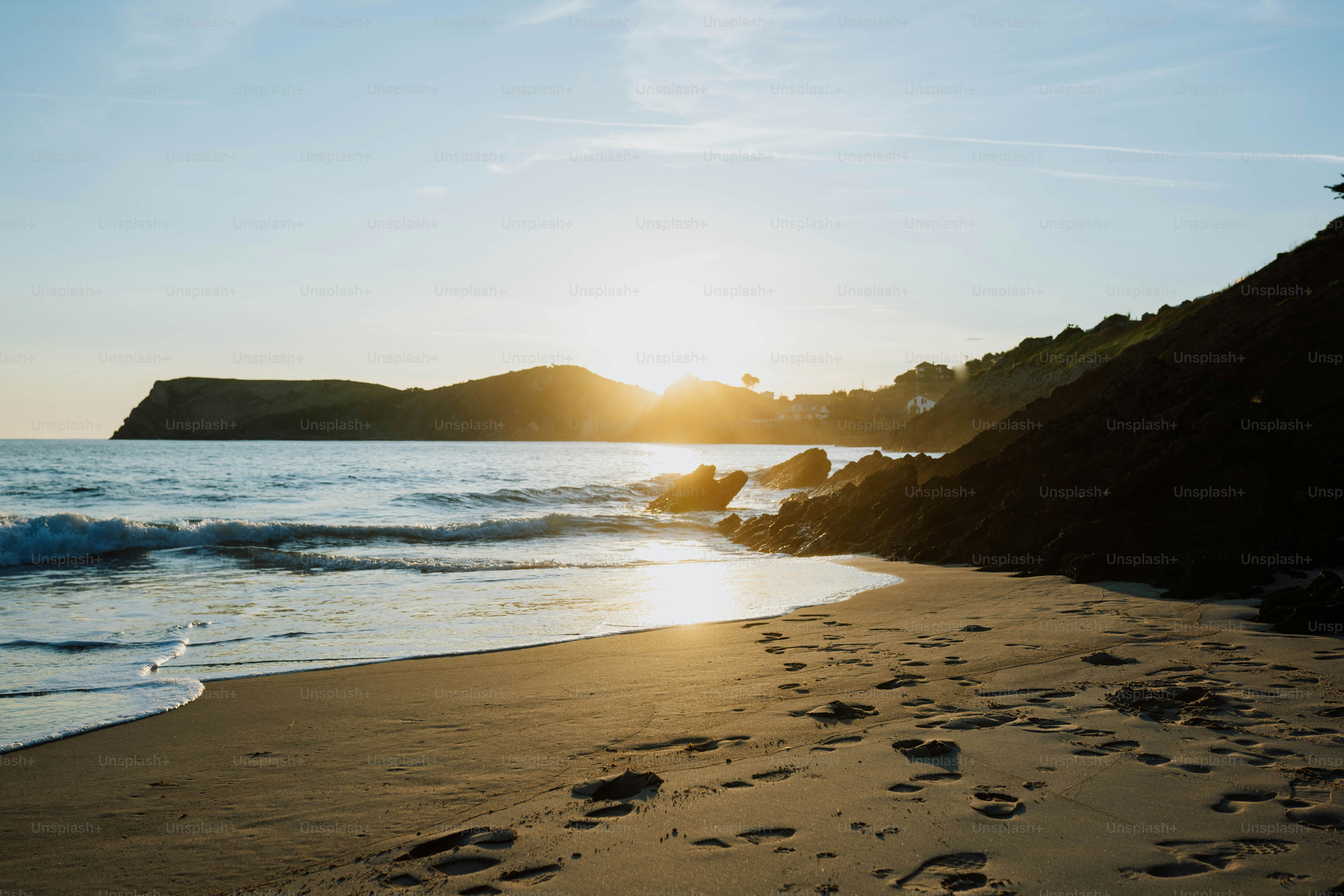 A sandy beach with footprints in the sand photo – Spring break Image on ...