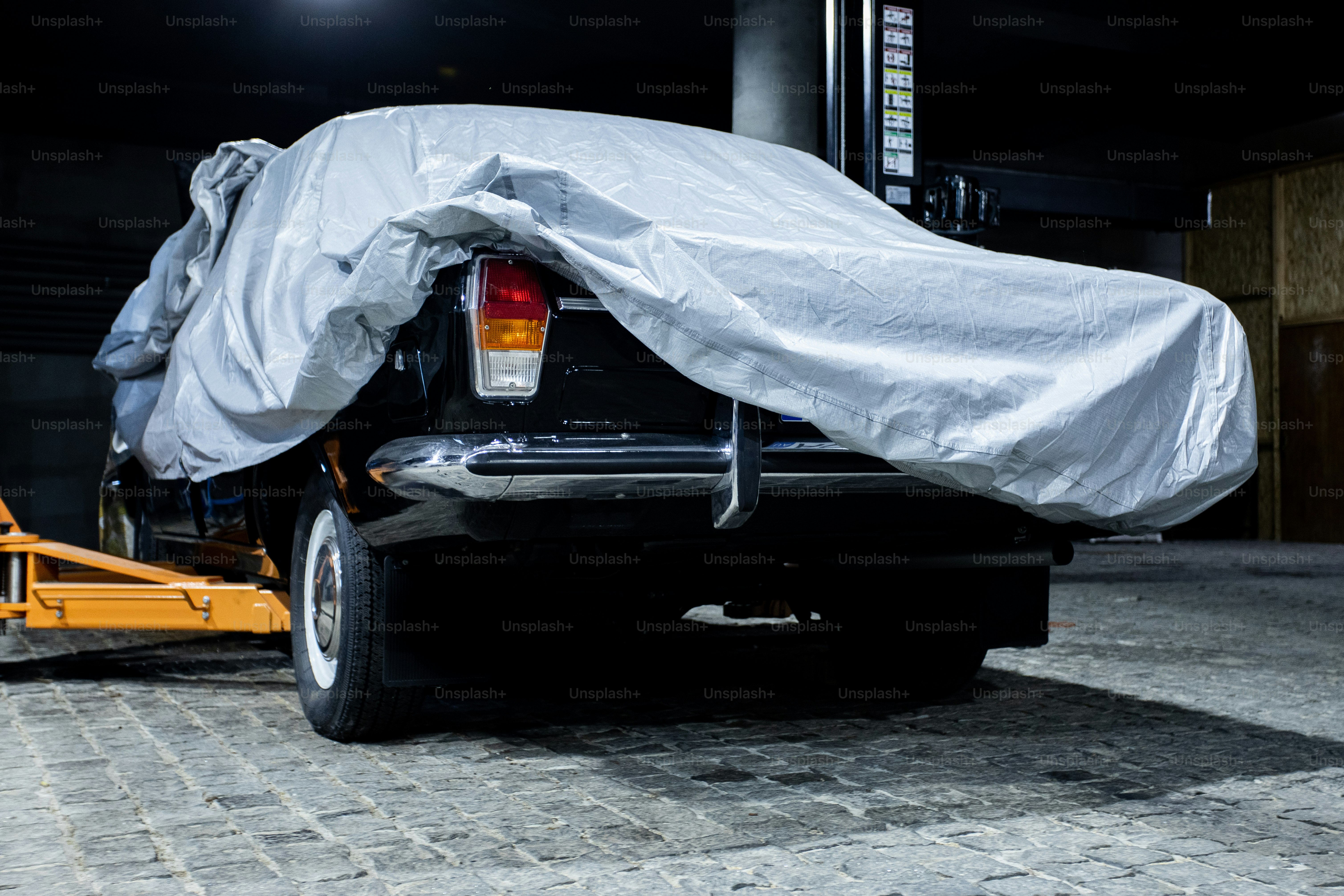 A car covered with a tarp and a tow truck photo – Car repair Image on ...