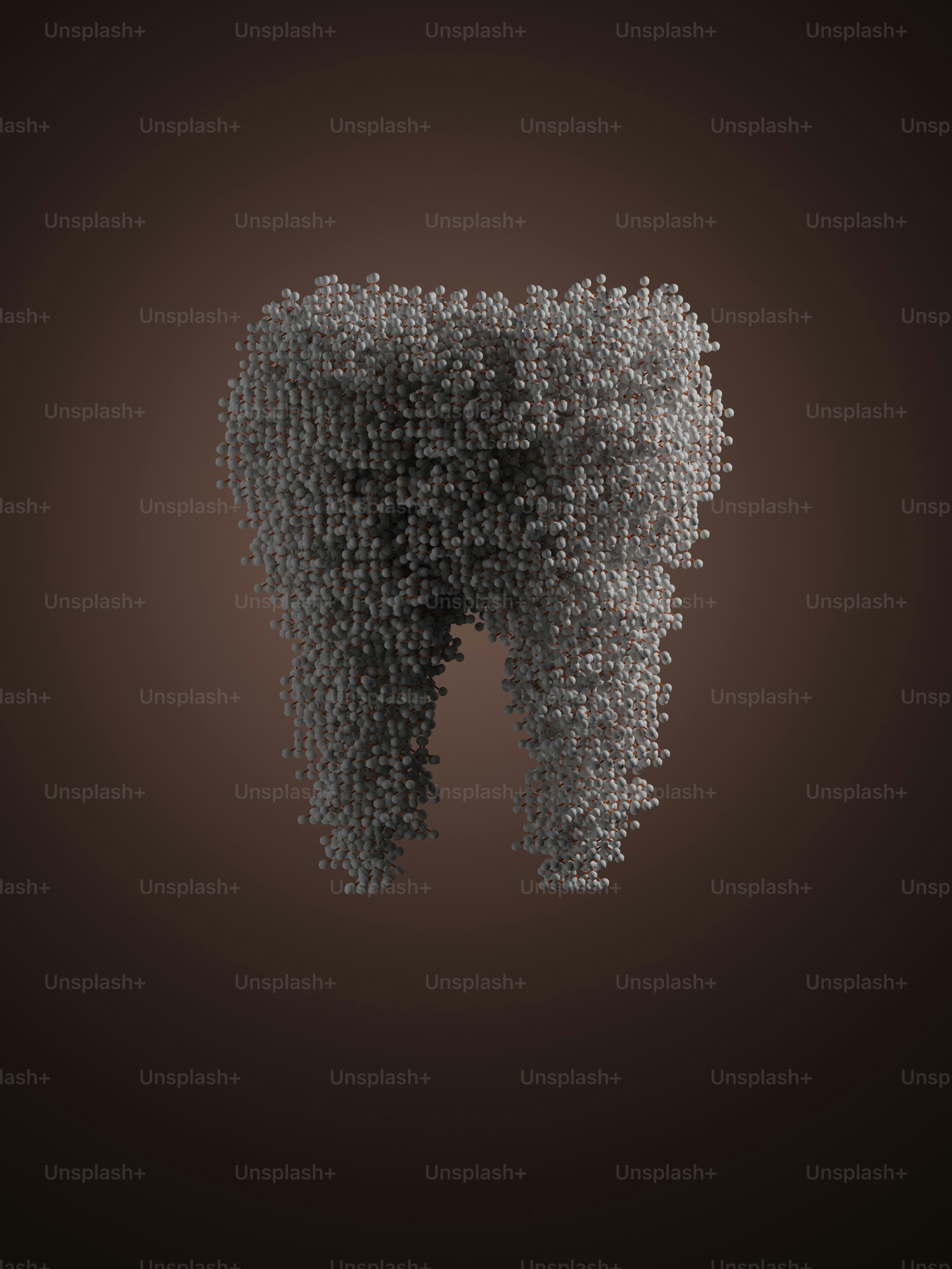 A tooth made up of small dots on a brown background photo – Screensaver ...