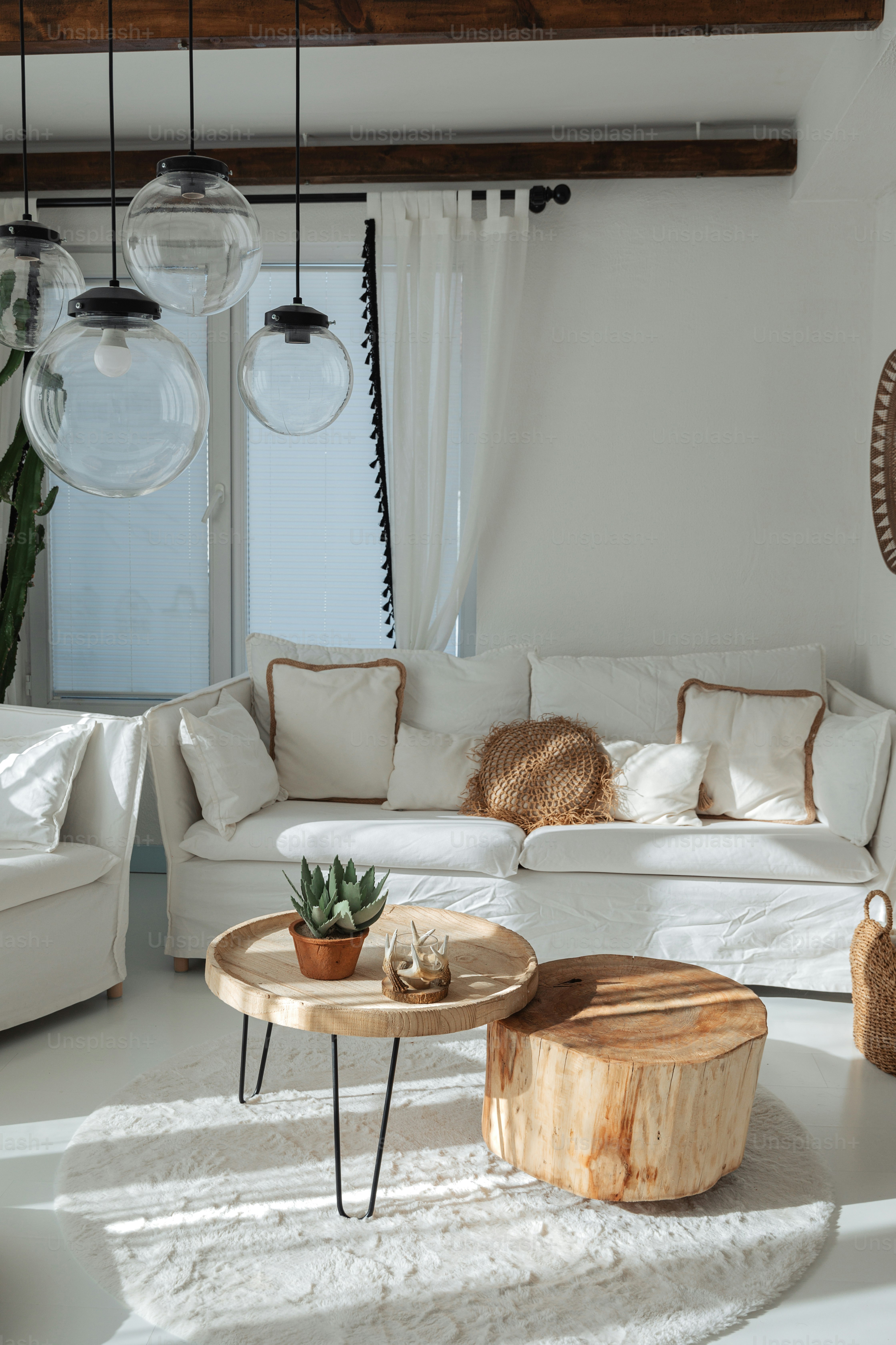 A living room filled with furniture and a wooden table photo – Interior ...