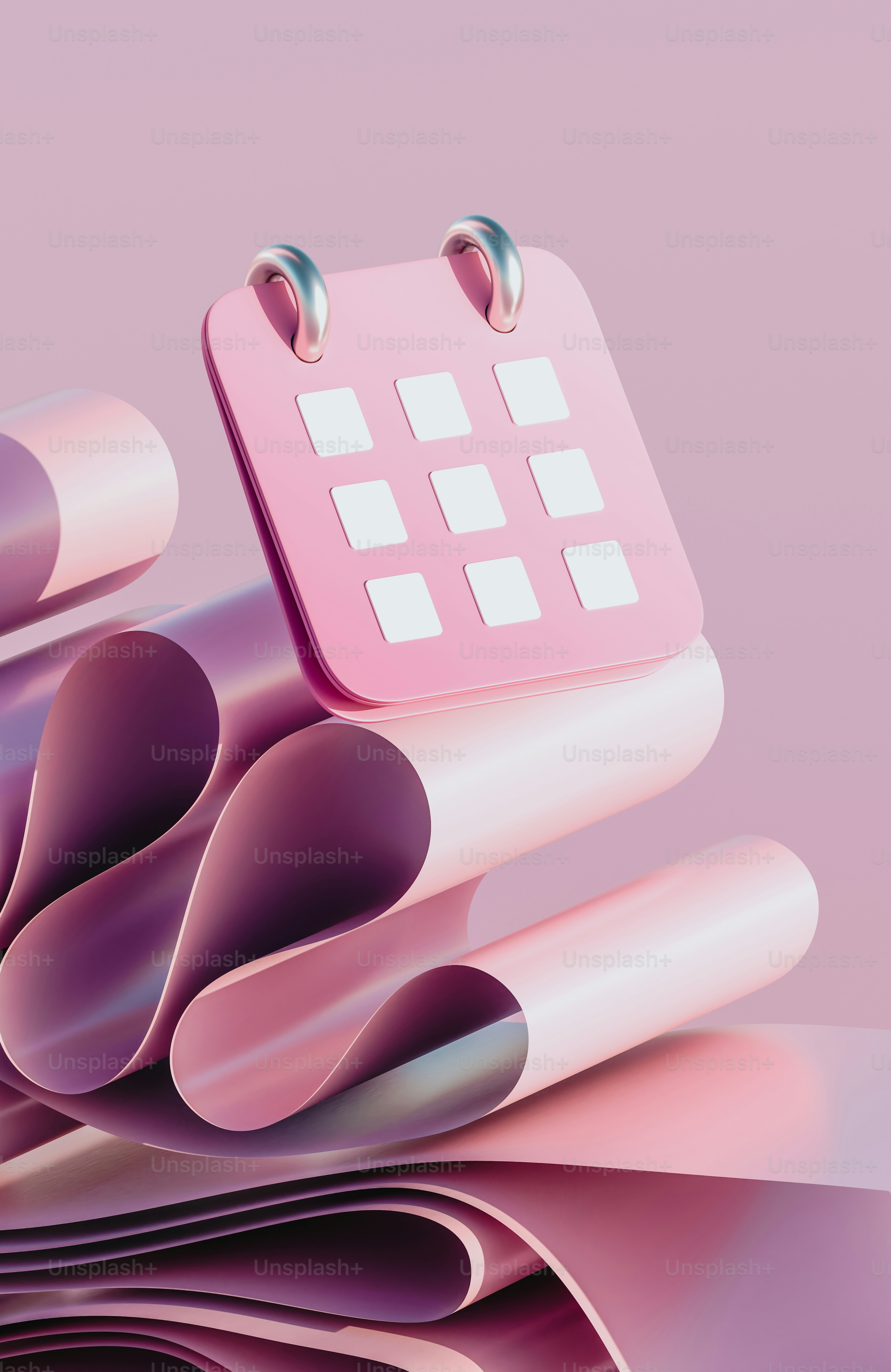 A pink calendar sitting on top of a pile of papers photo – Years Image ...