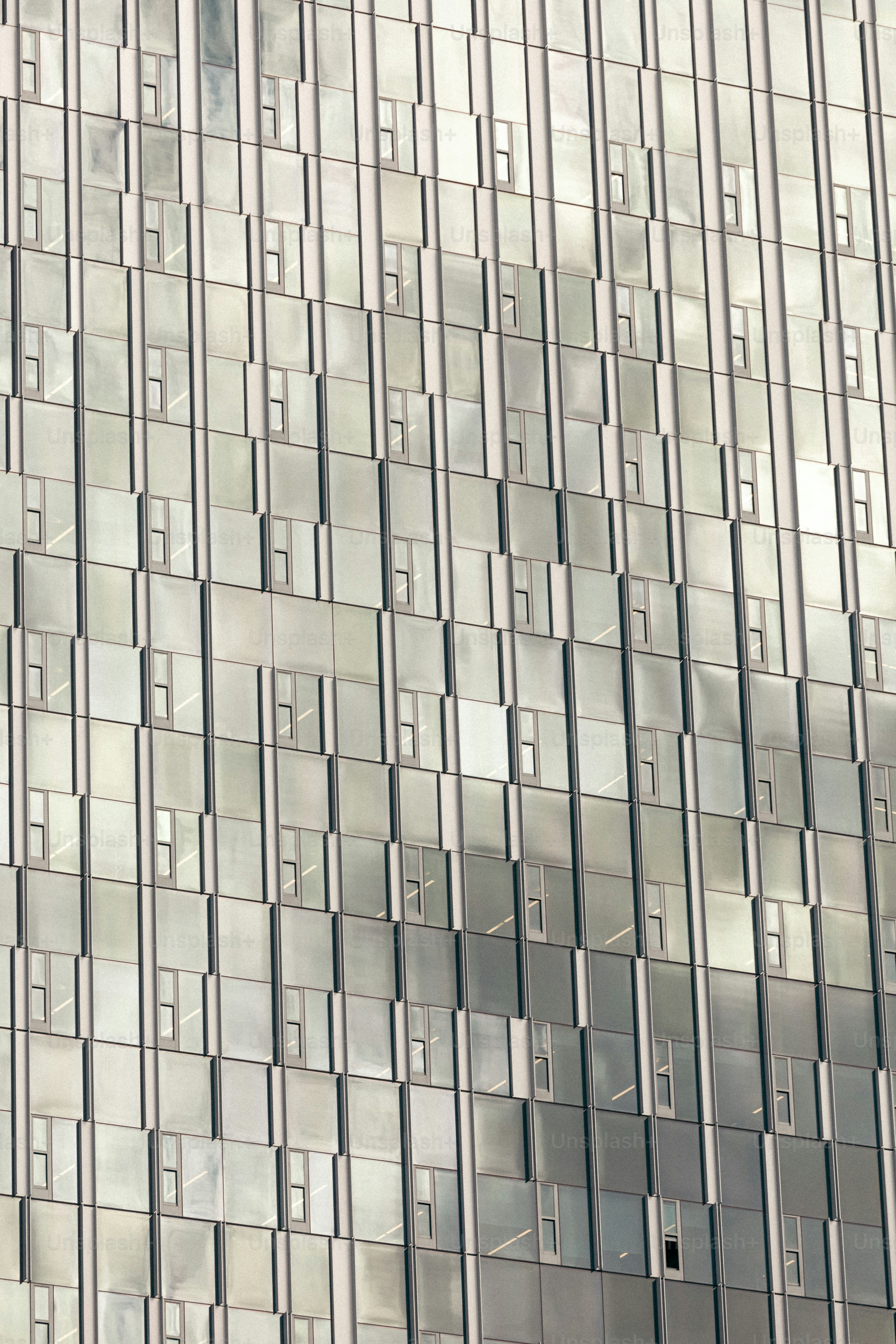 A very tall building with lots of windows photo – Building Image on ...