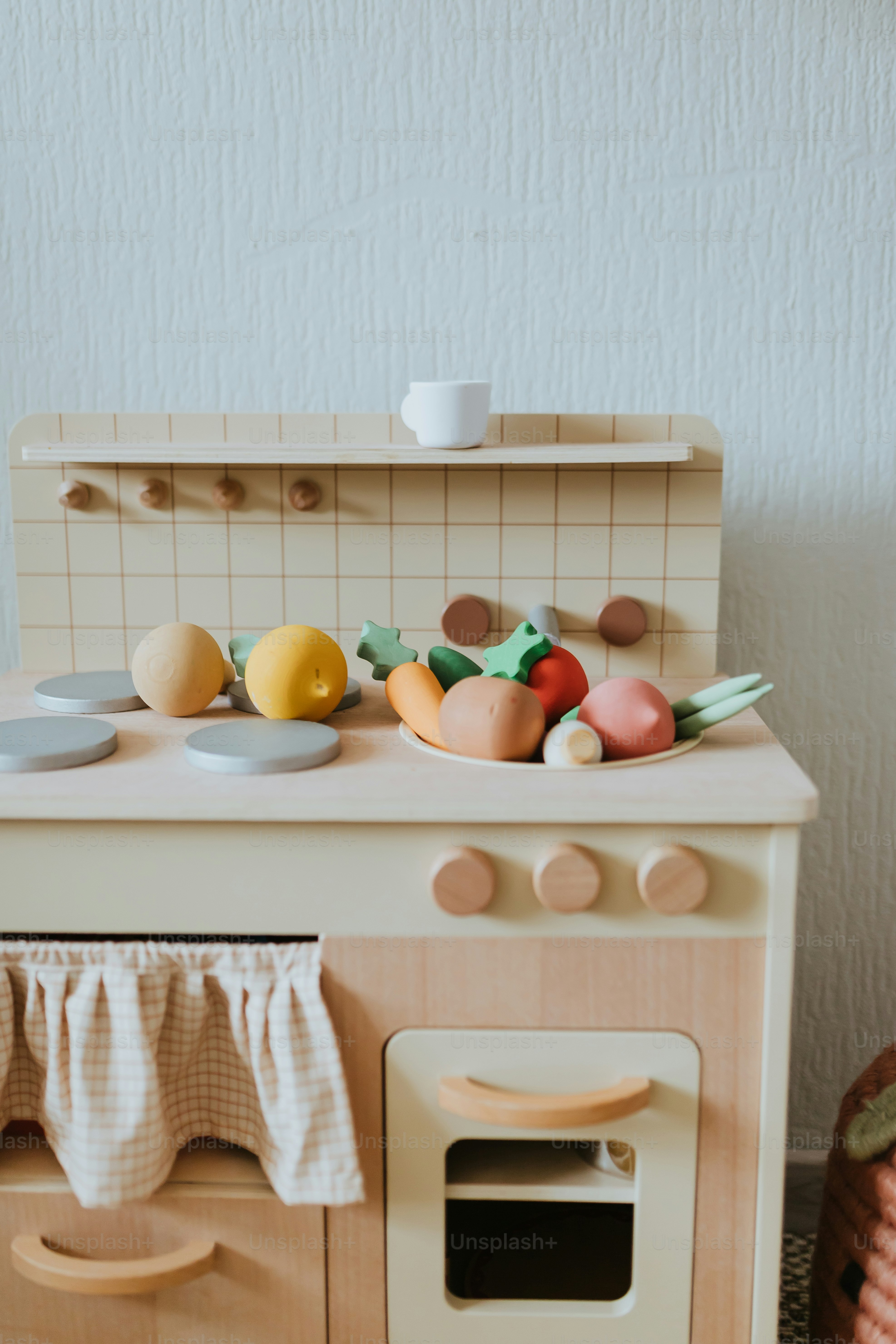 A toy kitchen with a wooden stove top oven photo – Tidy toys Image on ...