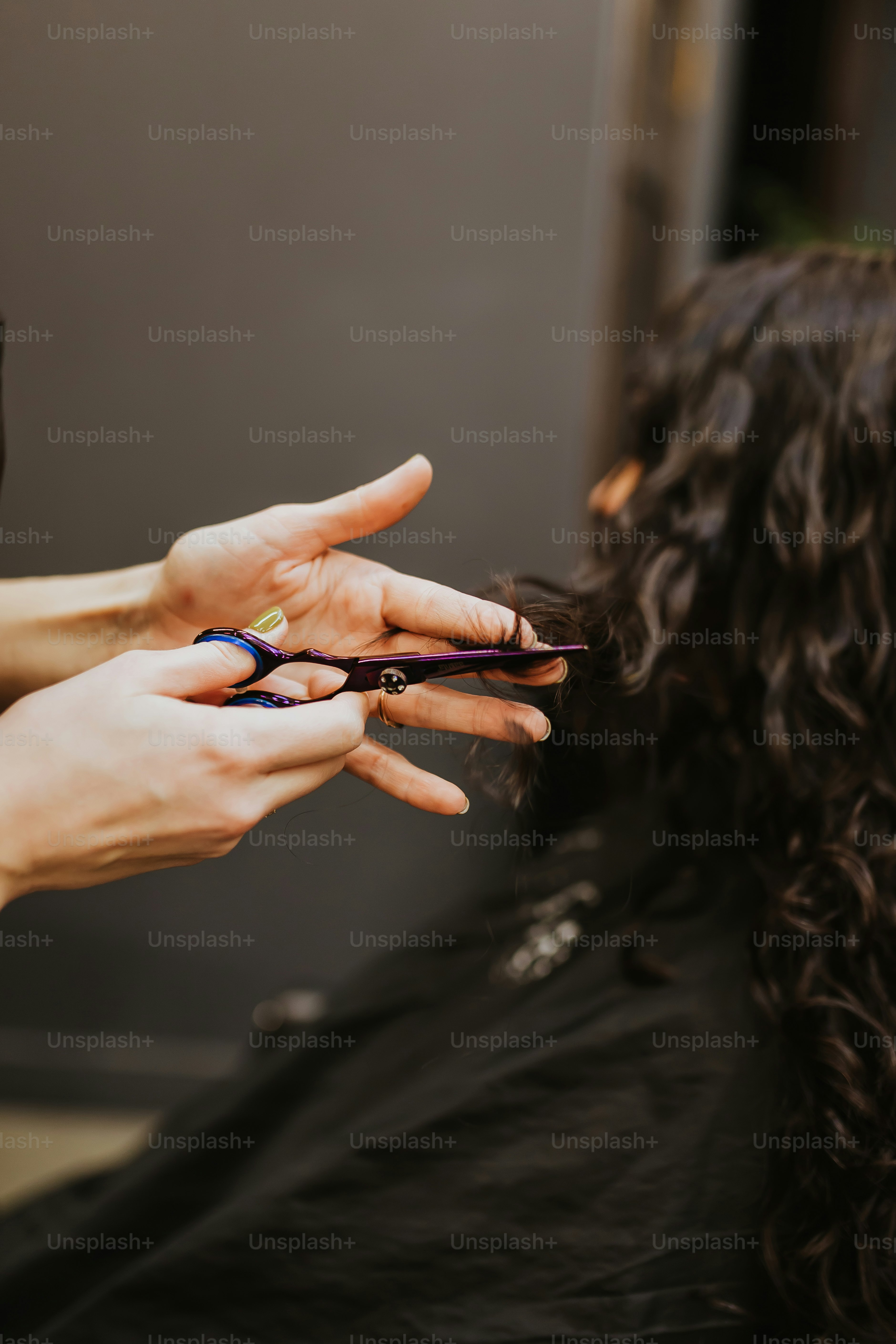 A woman cutting another woman's hair with scissors photo – Job Image on ...