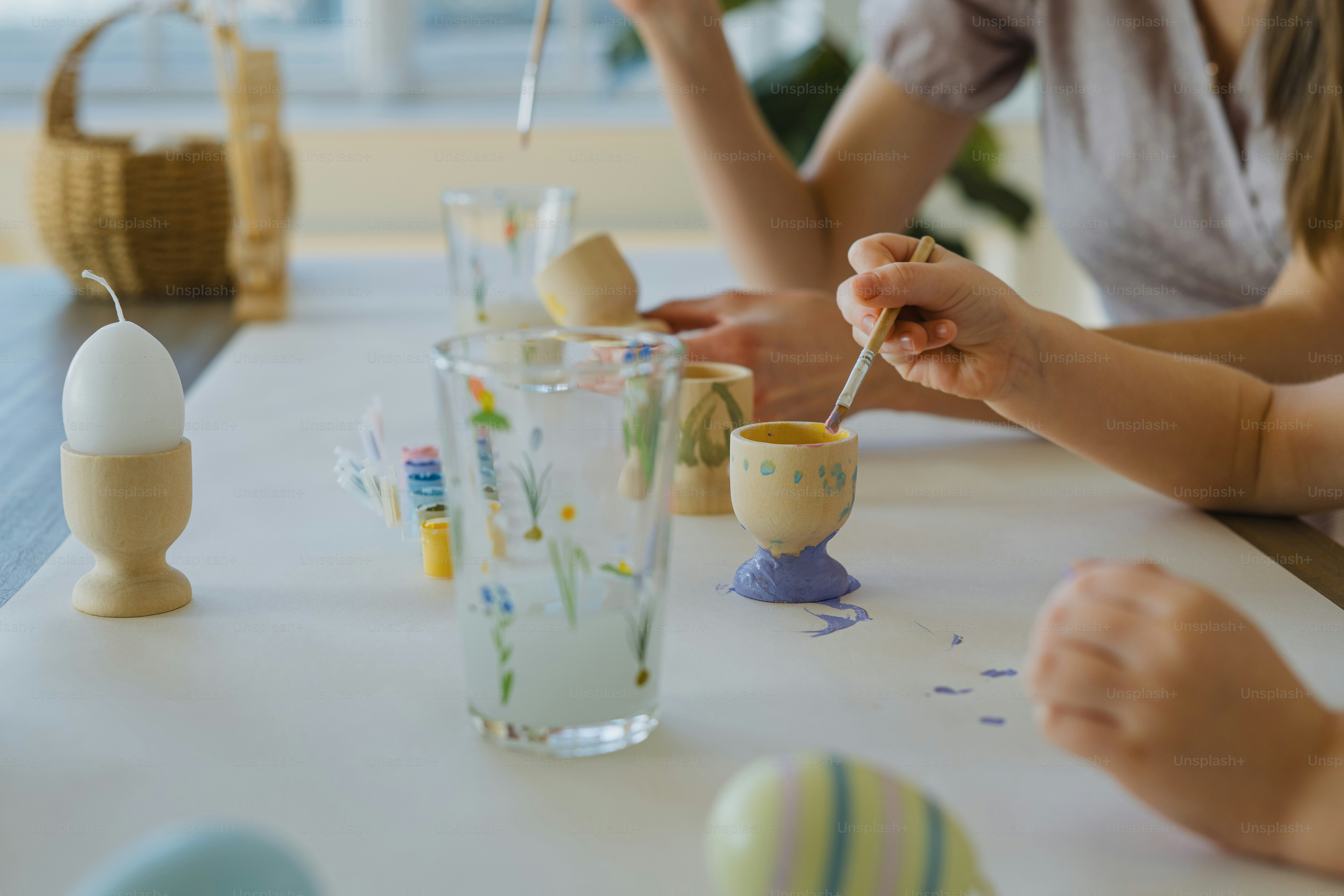 A table topped with lots of different colored eggs photo – Eggs Image ...